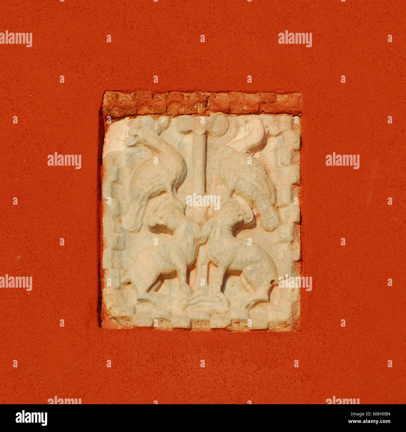 Old medieval byzantine relief with birds and animals on a wall in ...