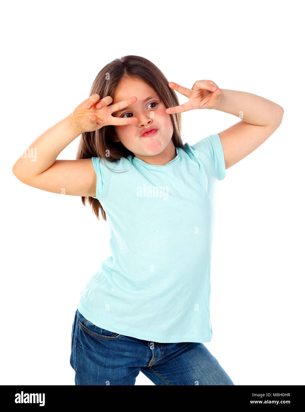 Funny small girl posing like a fashion woman isolated on a white ...