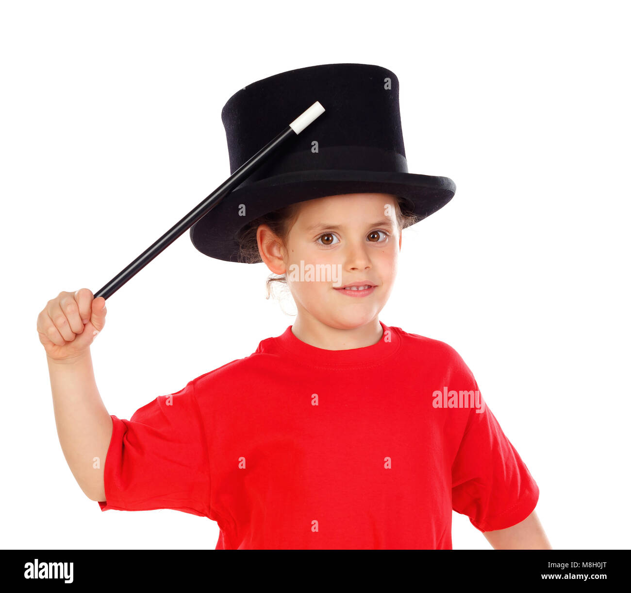 Pretty little girl doing magic with a top hat and a magic wand isolated ...