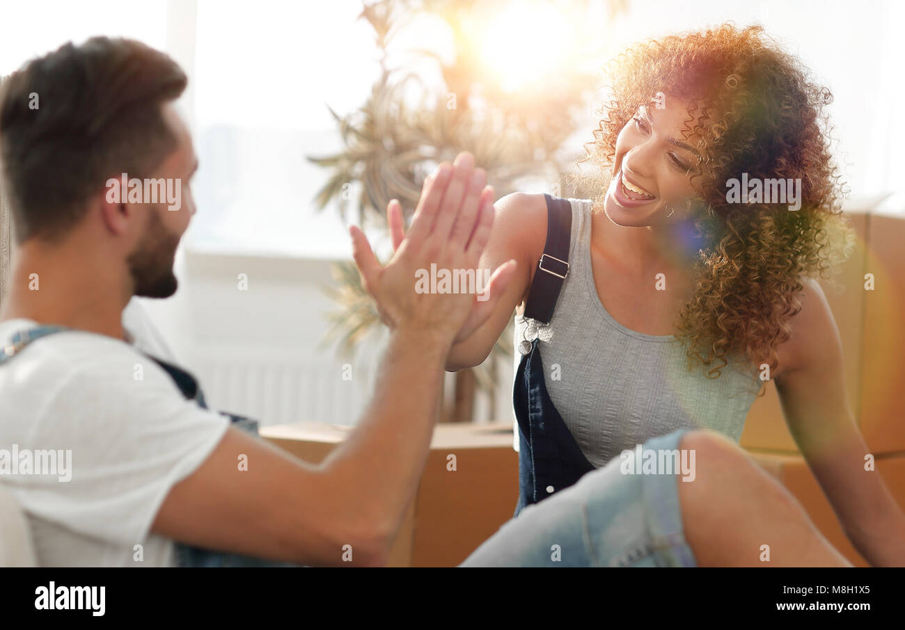 young couple giving each other five with a new home Stock Photo - Alamy