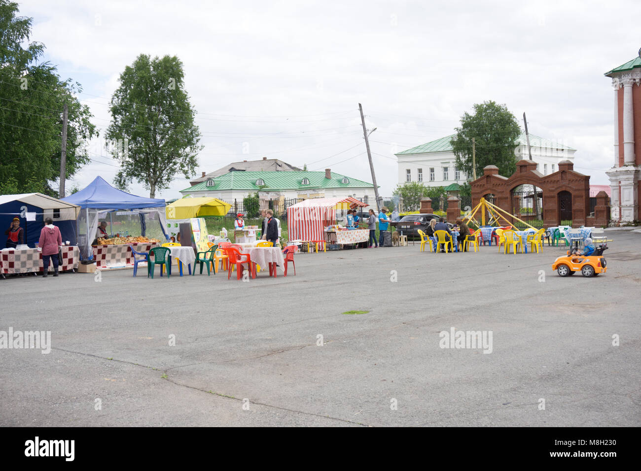Russia Usolye July 1, 2017: the provincial street market. Village road ...