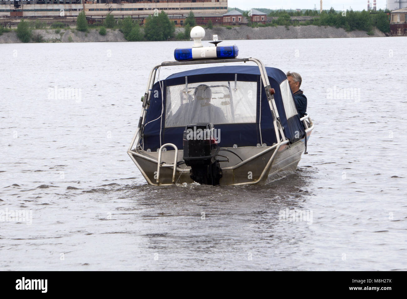a police boat patrols the waters of the channel Stock Photo - Alamy