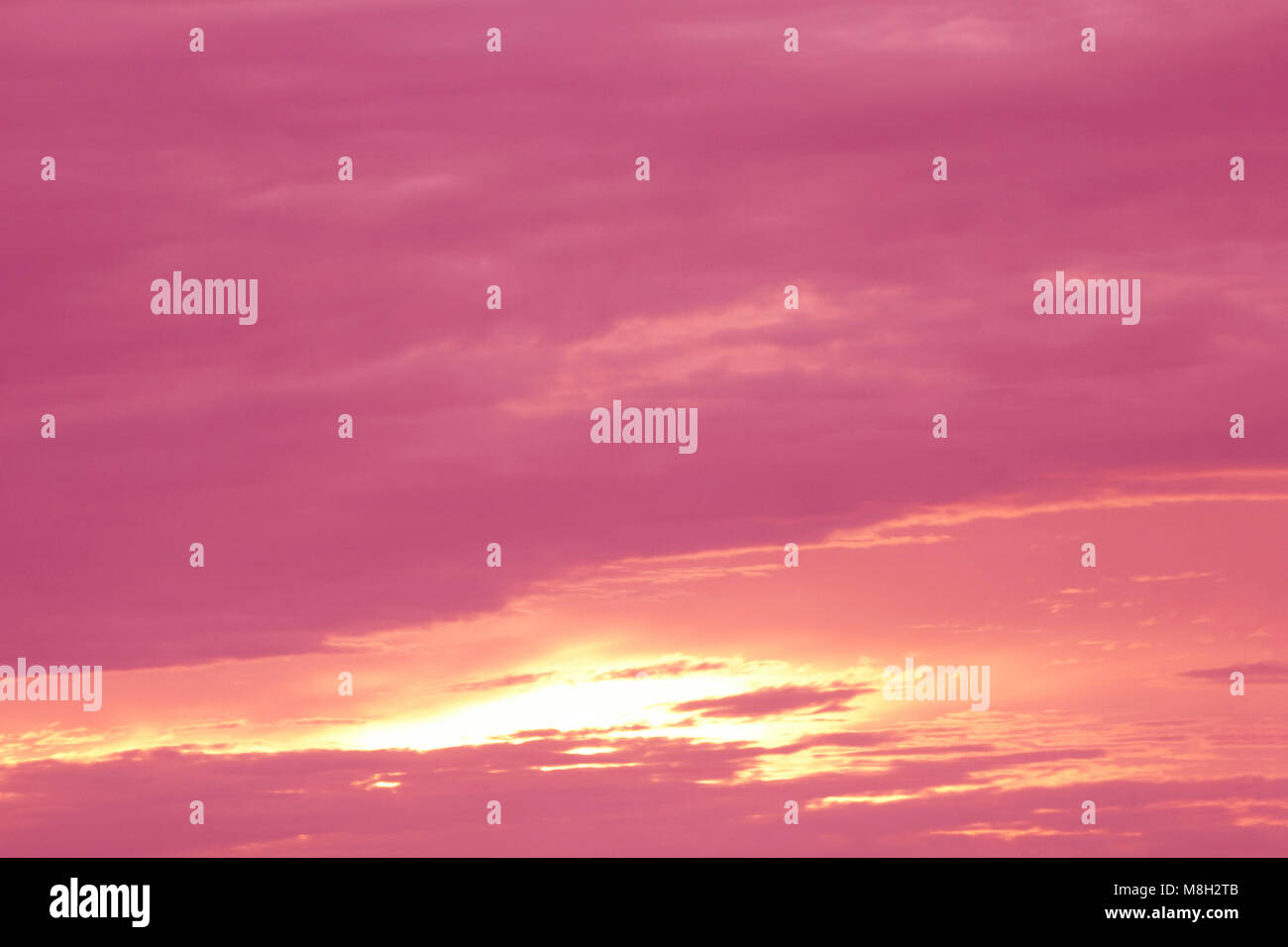 pink sunrise in the sea of incredible colors Stock Photo - Alamy