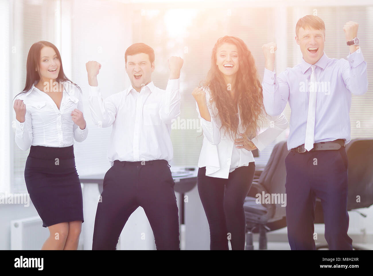 portrait of a triumphant business team Stock Photo - Alamy