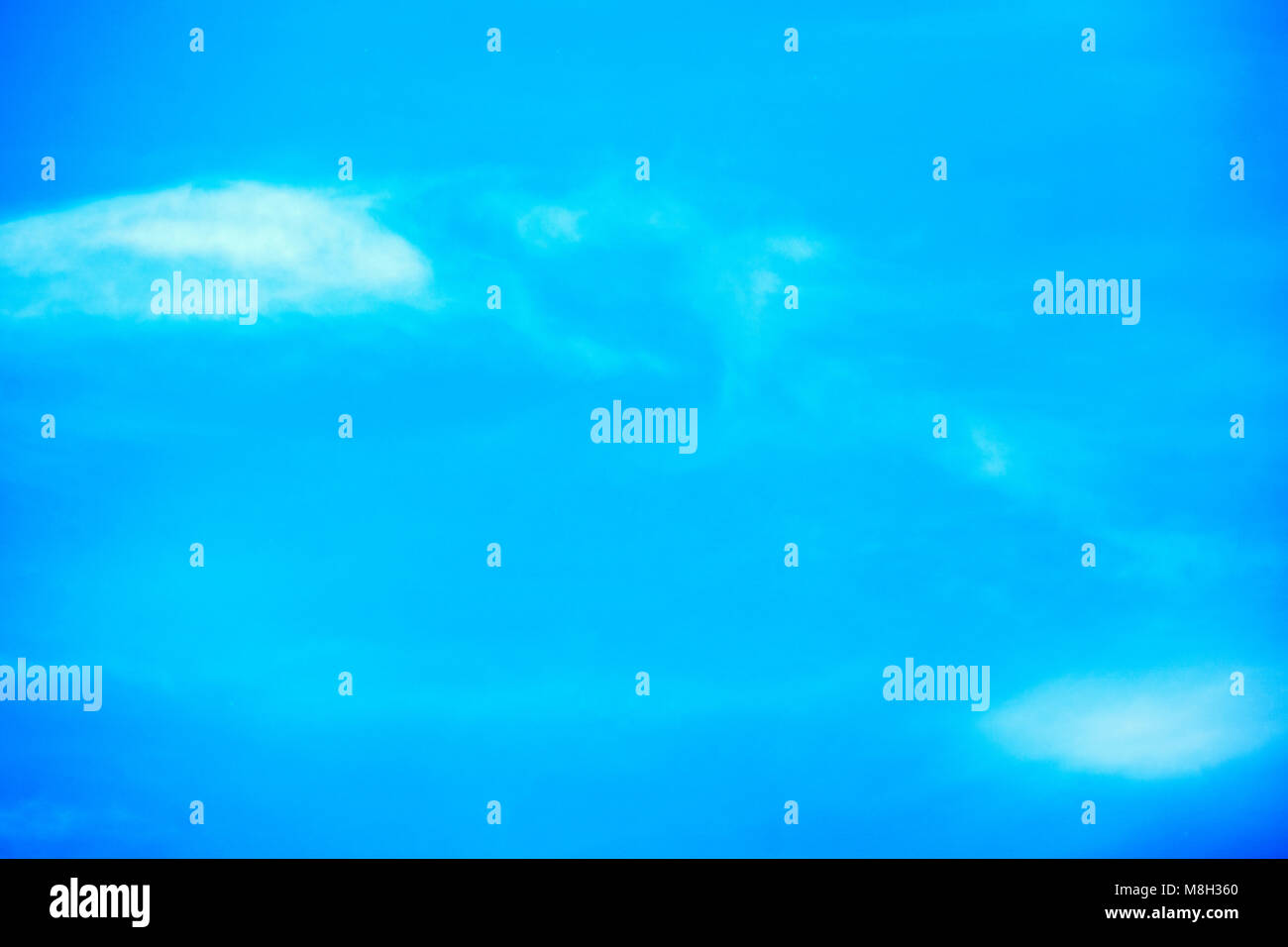 High white wispy cirrus clouds with cirro-stratus in the blue ...