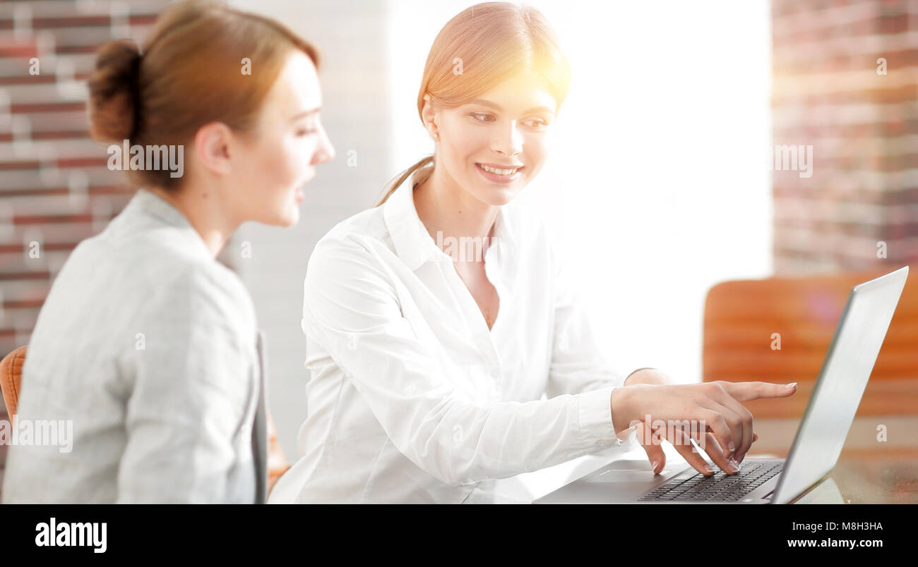 woman Manager shows the client information on the laptop Stock Photo ...