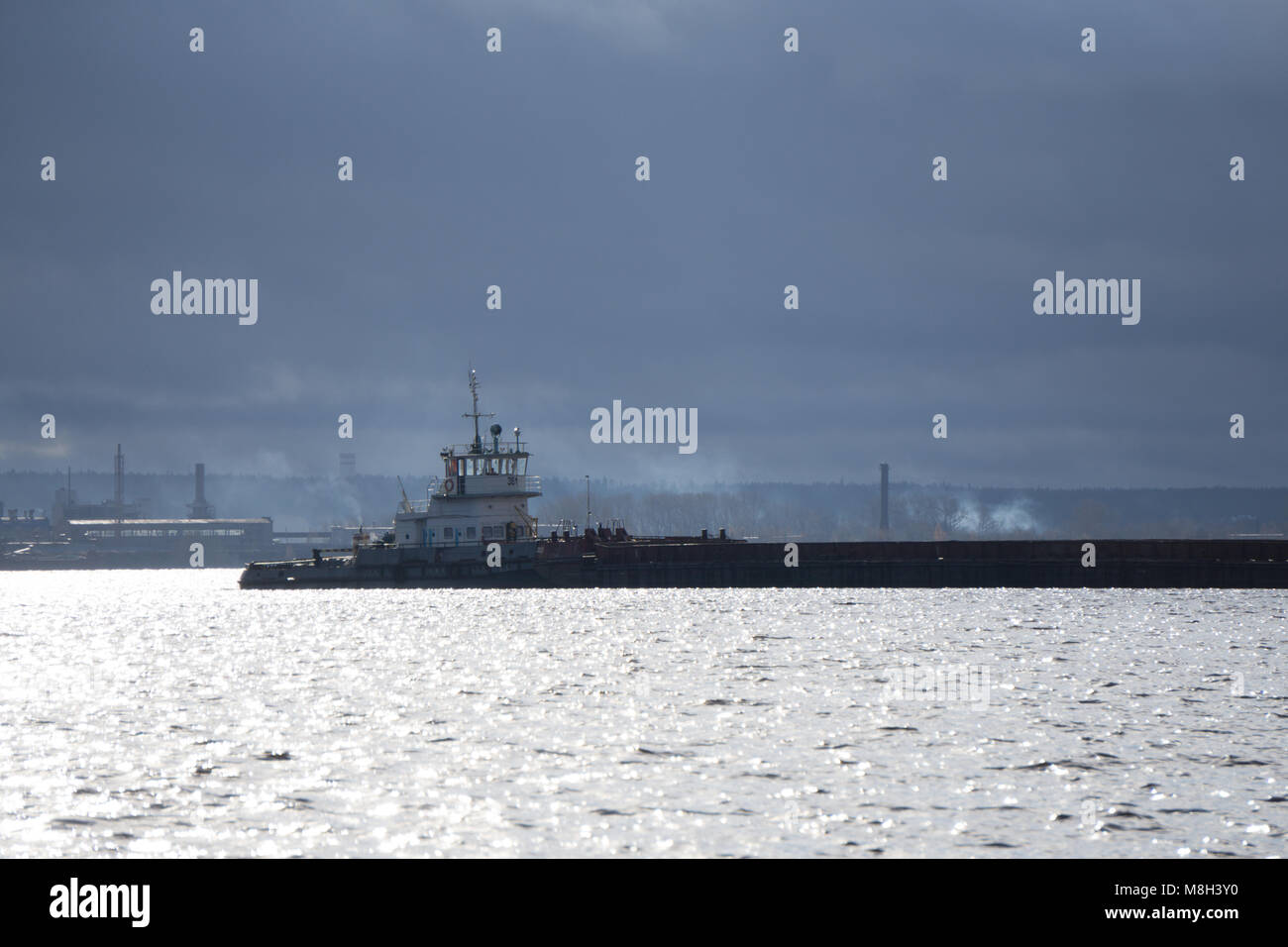 Large cargo barges, transporting iron ore mined in the interior of the ...