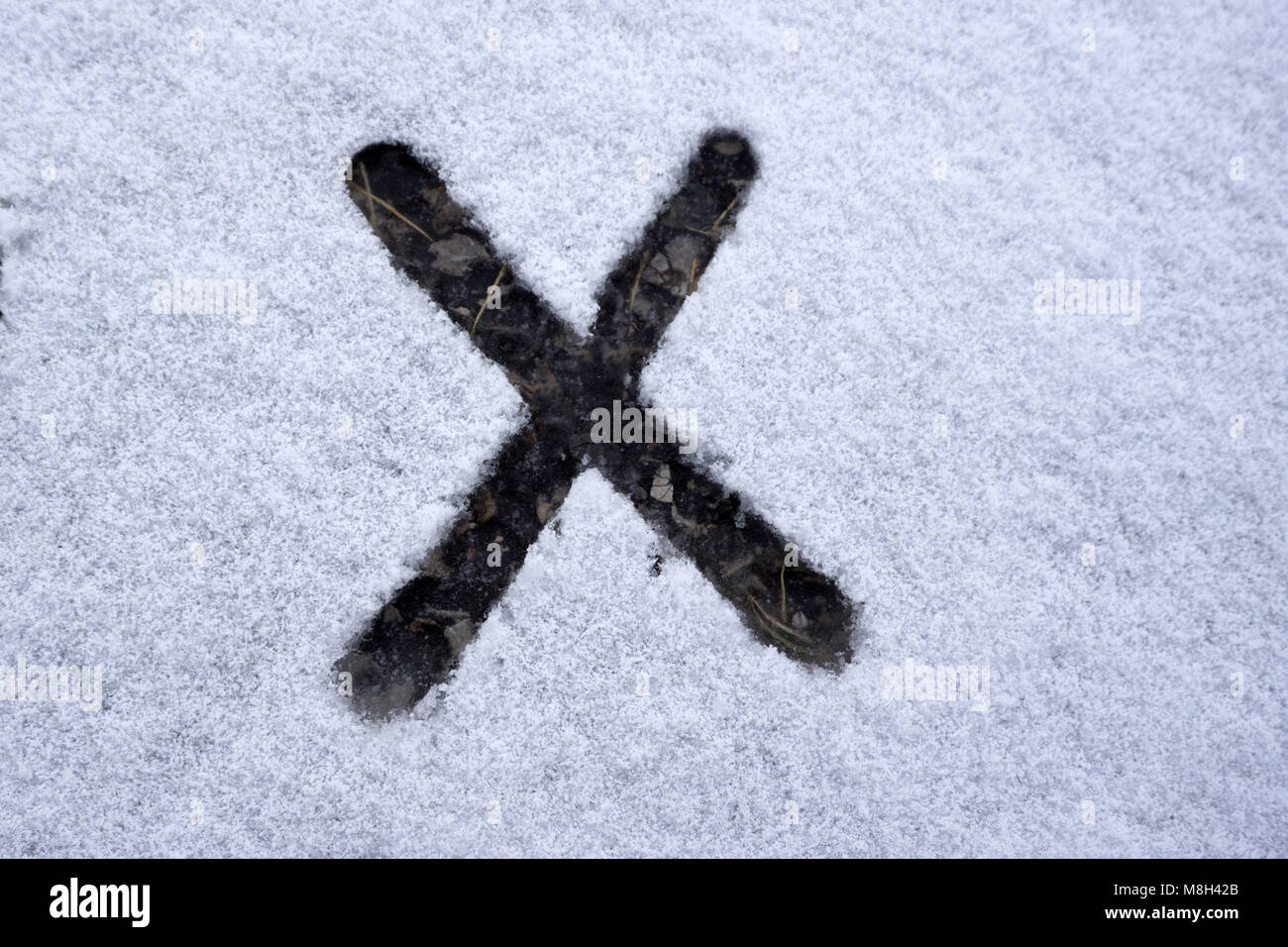 cross sign or multiplying on white surface Stock Photo - Alamy
