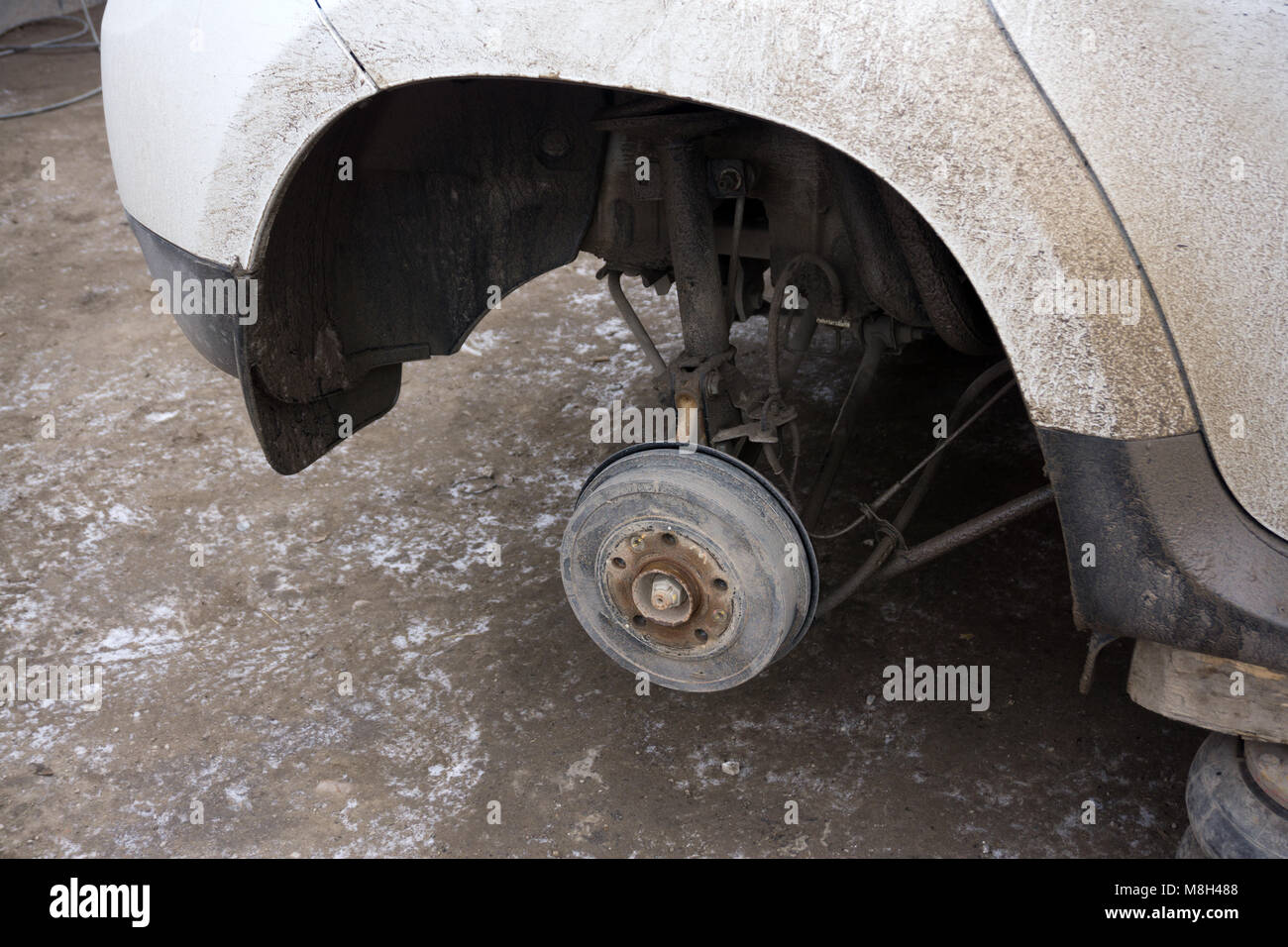 Closeup disc brake of the vehicle for repair. shot wheel, the tool for ...