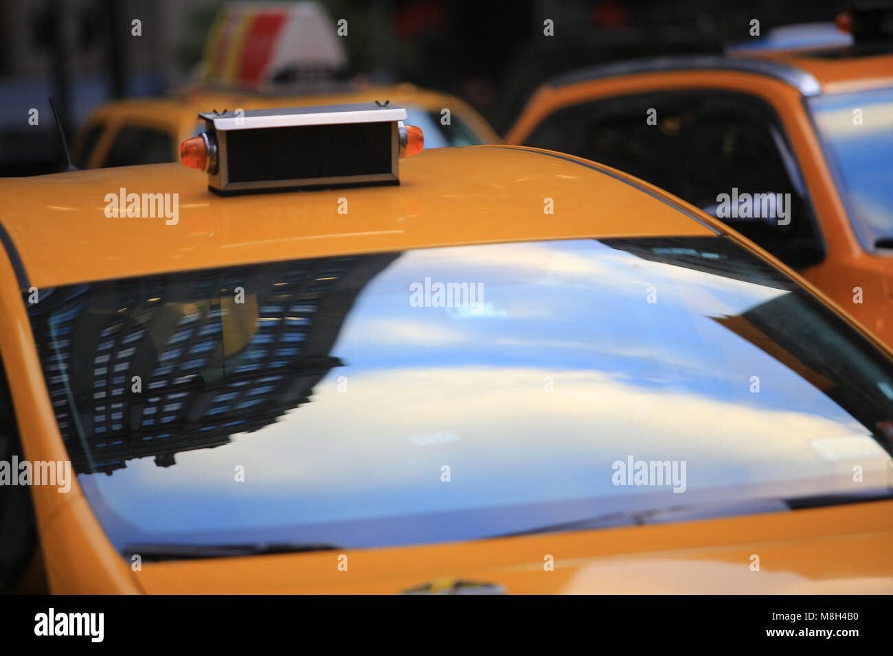 yellow taxi reflect the afterglow Stock Photo - Alamy