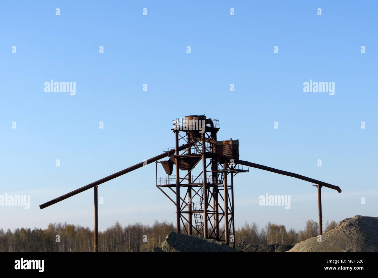 Sand mining night shift with sunset sky Stock Photo - Alamy