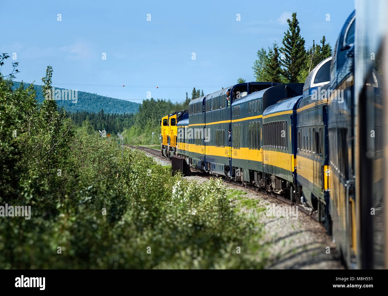 Tourist train winding through the pristine Alaskan landscape, Alaska ...