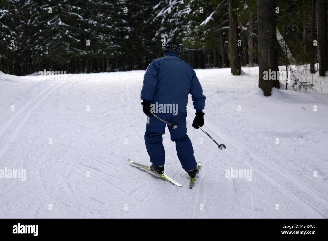 Skier on piste in high mountains Stock Photo - Alamy