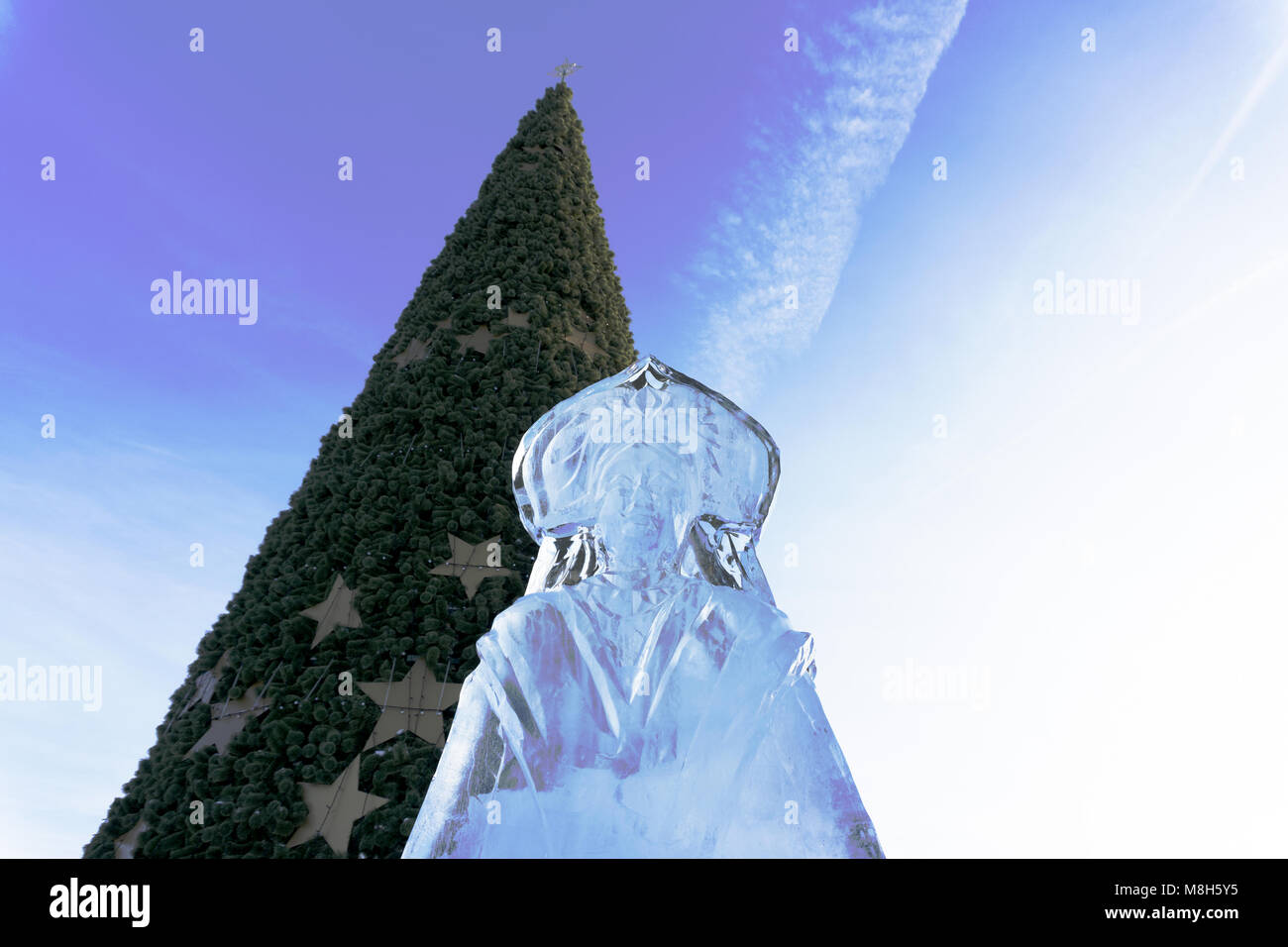 Christmas ice sculptures with a headdress girl Stock Photo - Alamy