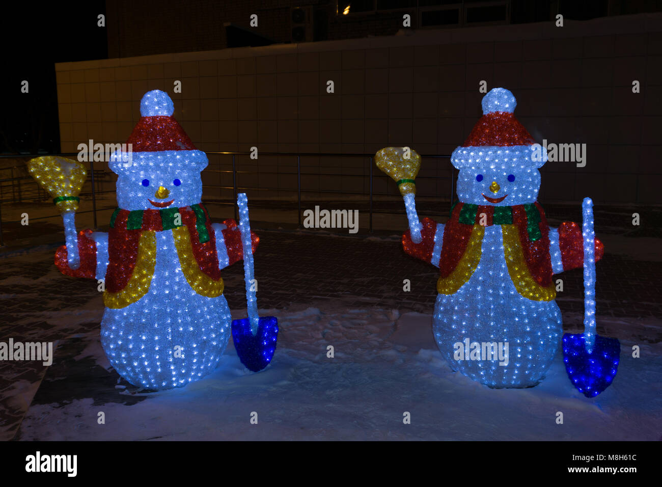 Frosty the Snowman Next to Christmas Lights on Home Stock Photo - Alamy