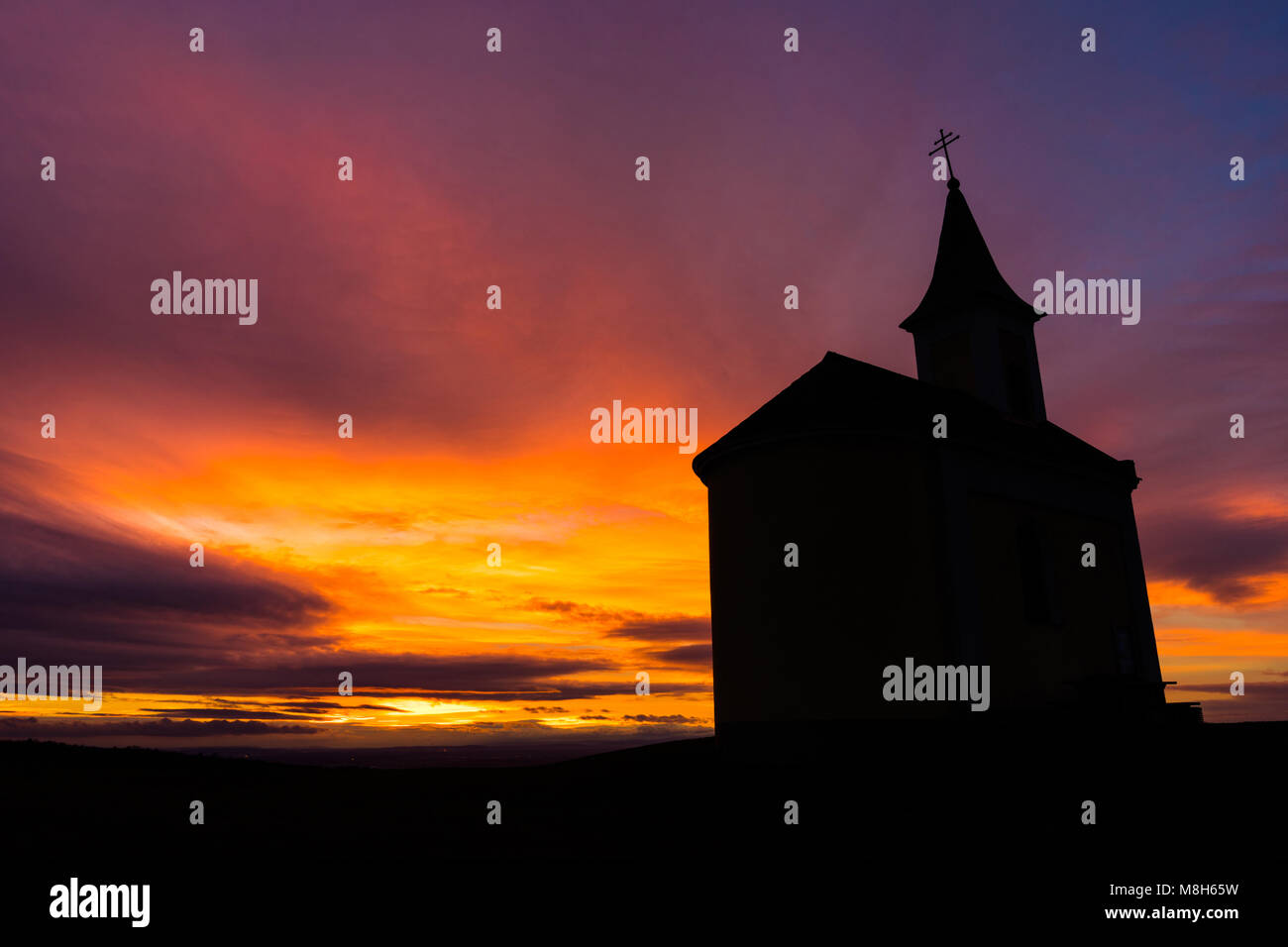Sunset with church silhouette Stock Photo - Alamy