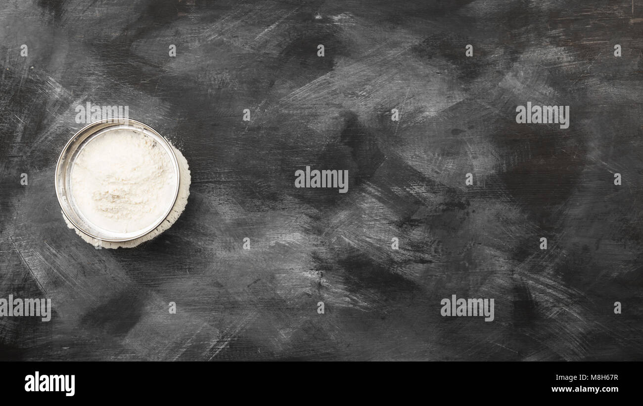 Sieve with flour on dark background. Top view, copy space. Food ...