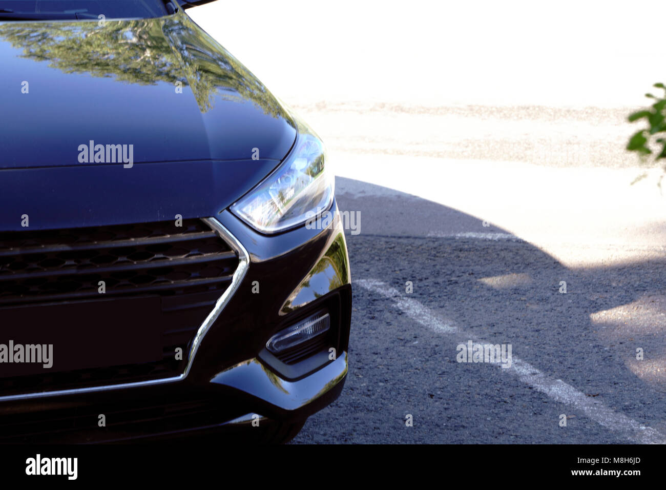 dark brown car on a city street Stock Photo - Alamy