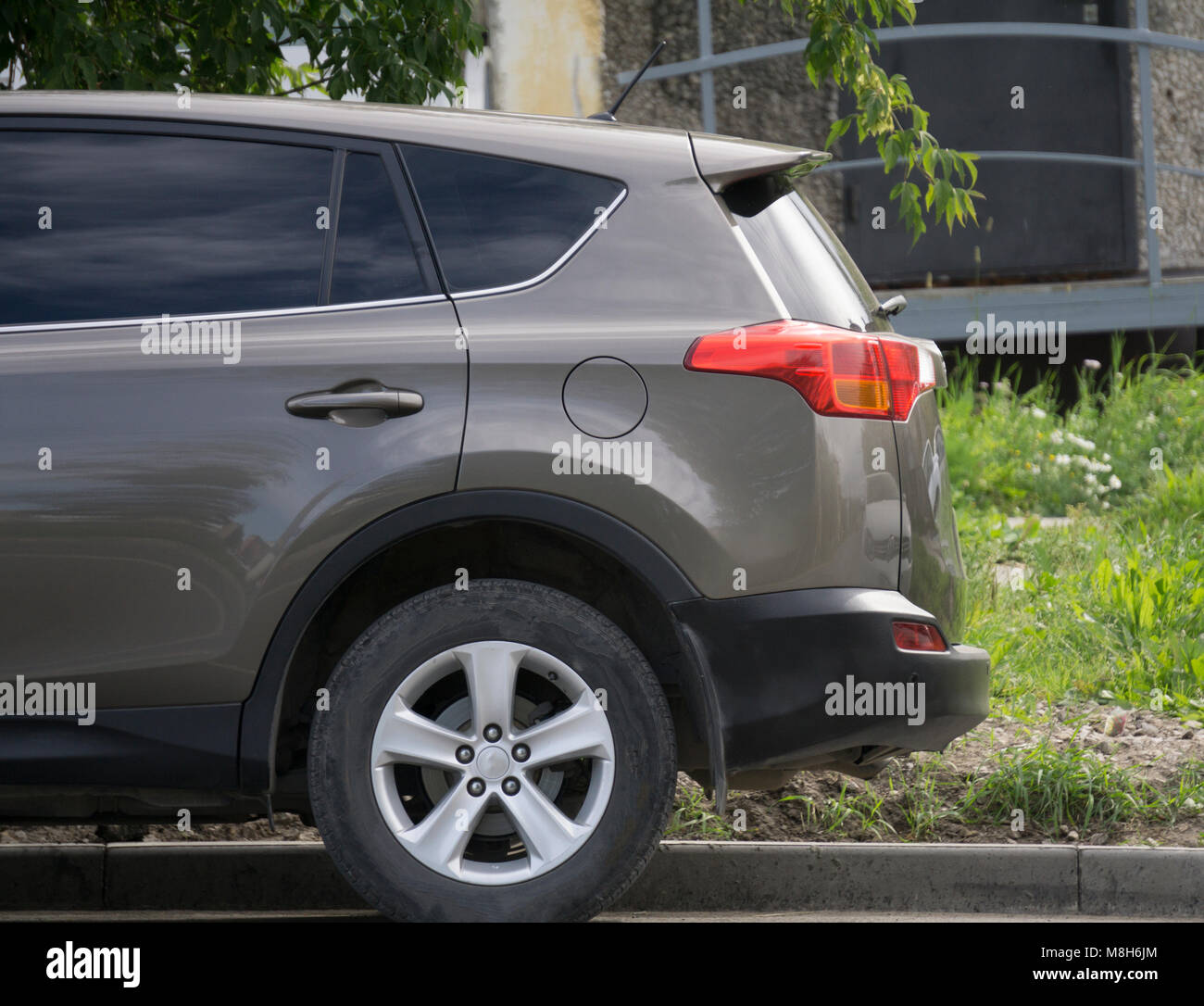 brown car of the middle class Stock Photo - Alamy