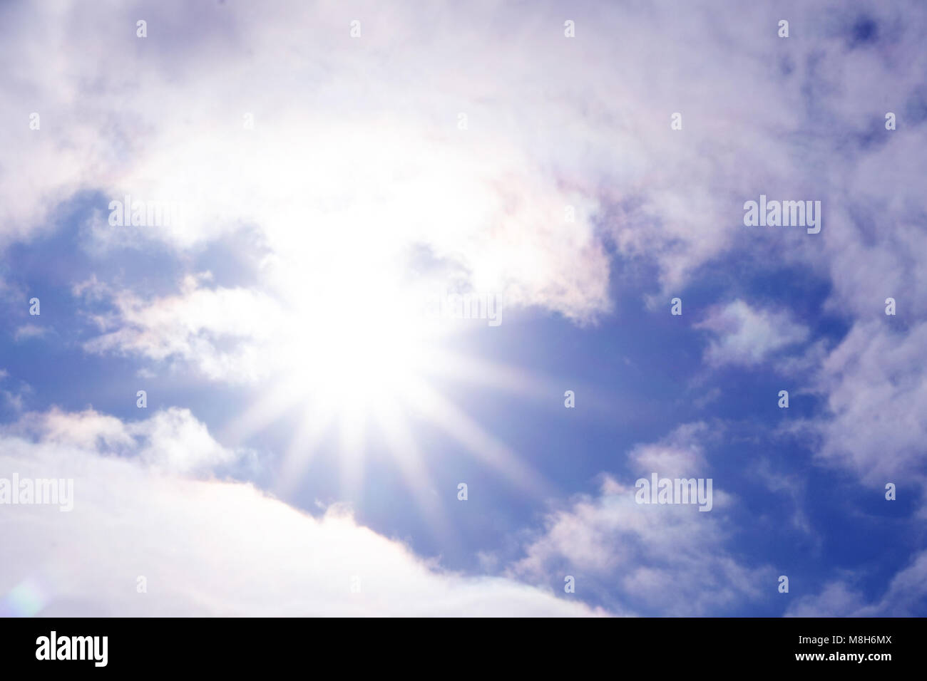 The wind hardly pushes the clouds across the sky , visible rays of the ...