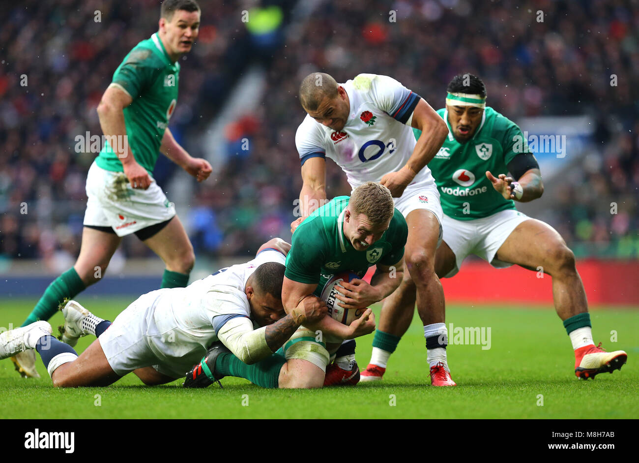 England's Kyle Sinckler (left) and Jonathan Joseph (centre) tackle ...