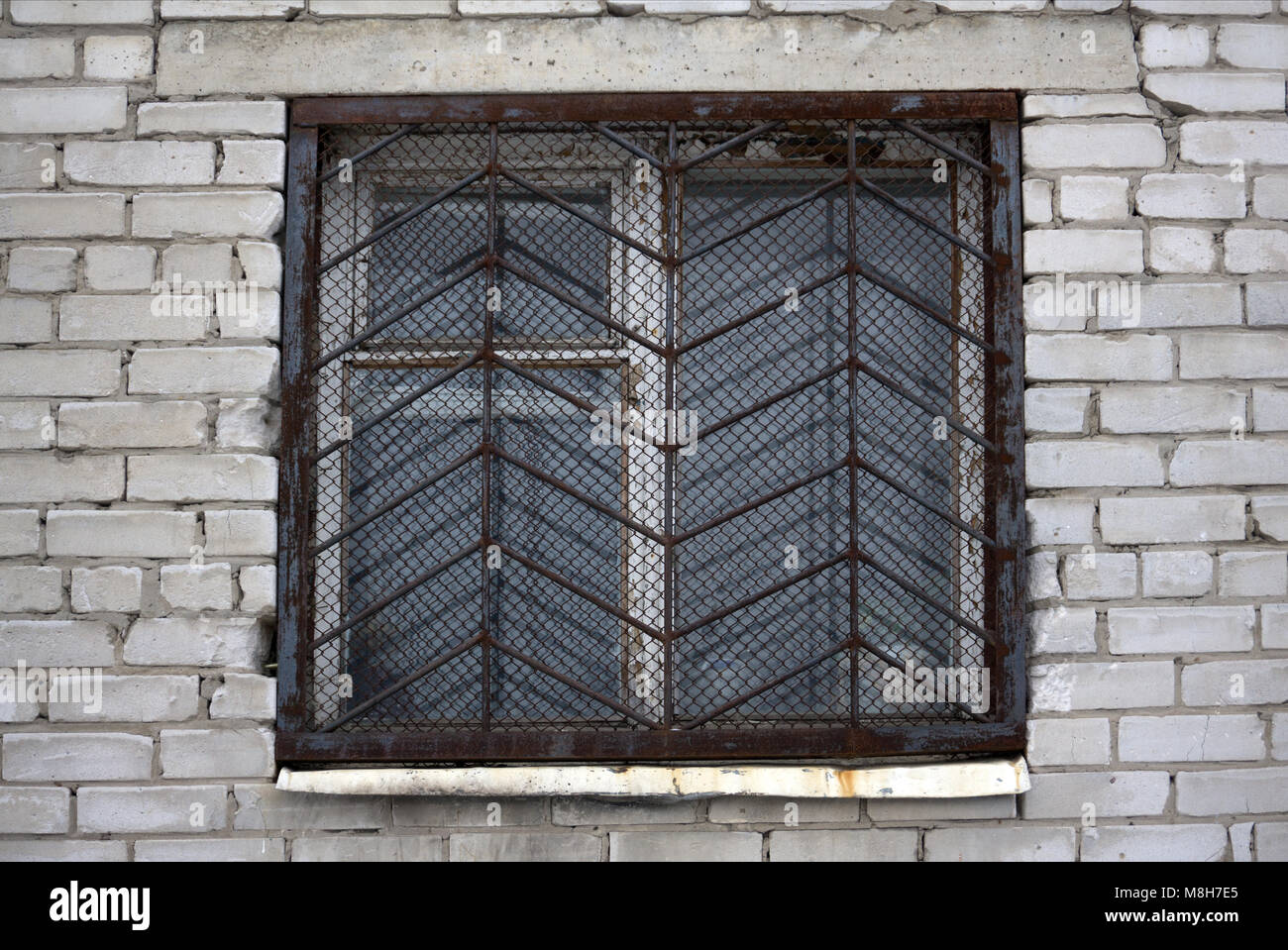 window with iron grating on stone wall Stock Photo - Alamy