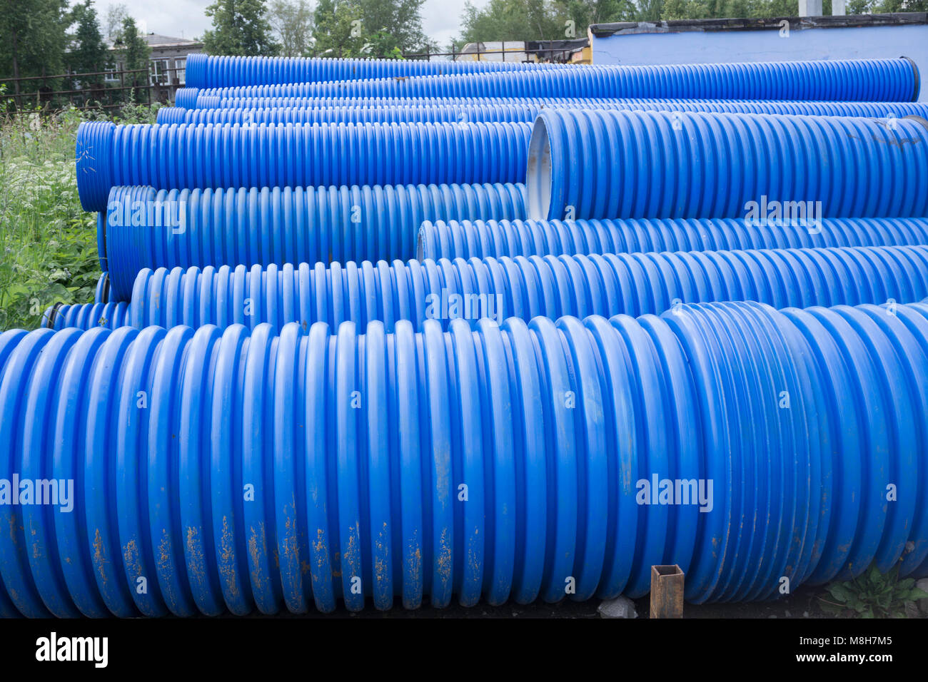 Blue corrugated pipe for electrical high-voltage cables isolated on ...