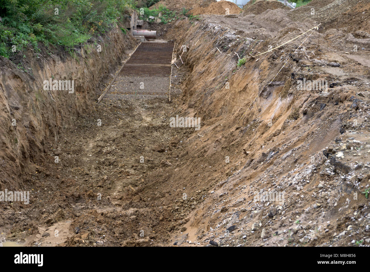 trenches dug in the city for the laying of concrete dig trenches Stock ...