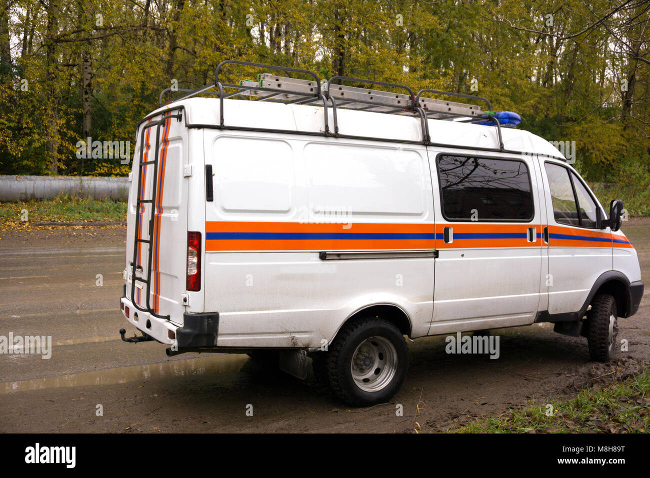Ambulance in motion driving down the road. Intentional motion blur ...