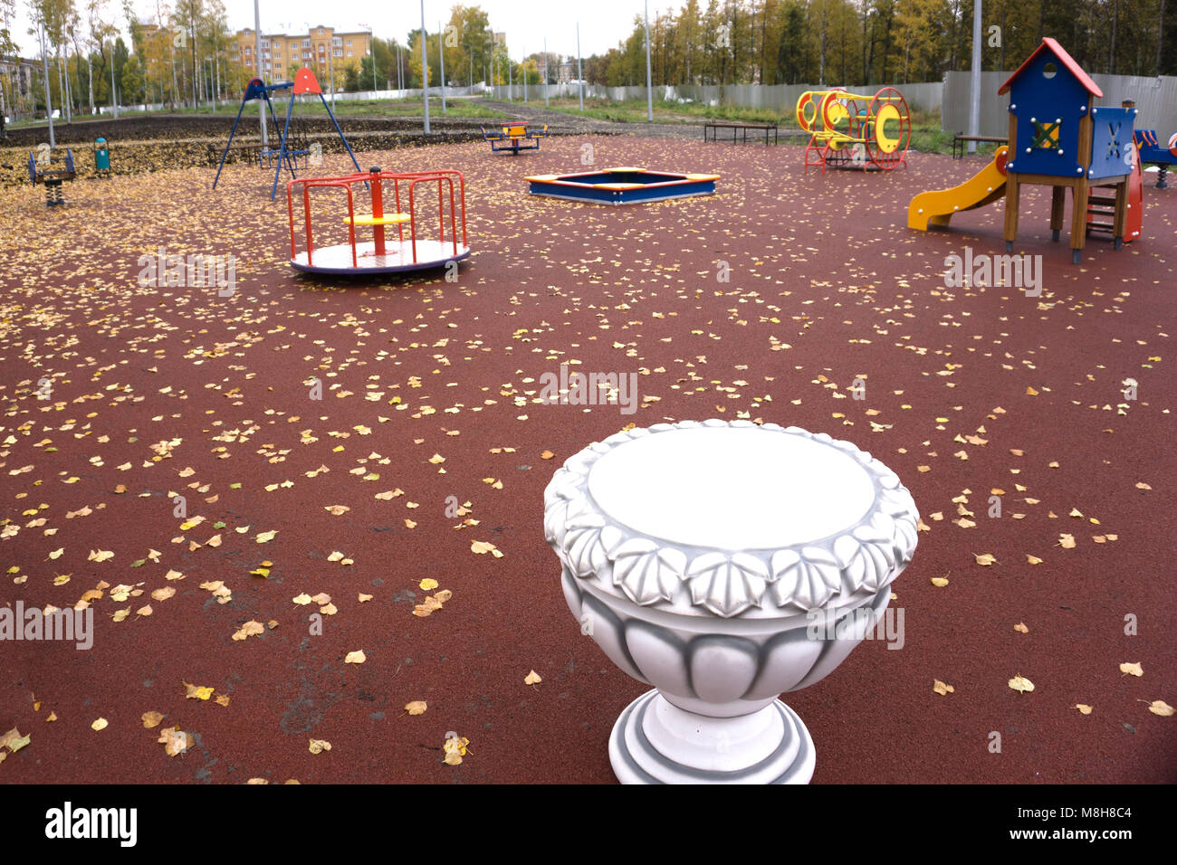 children playground in park trees tube yellow Stock Photo - Alamy