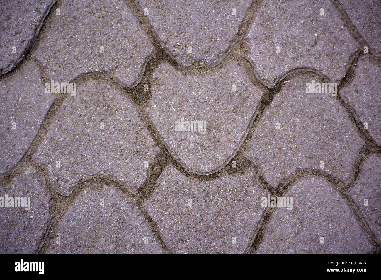 pink cement block on sidewalk, street paving slab, background and ...