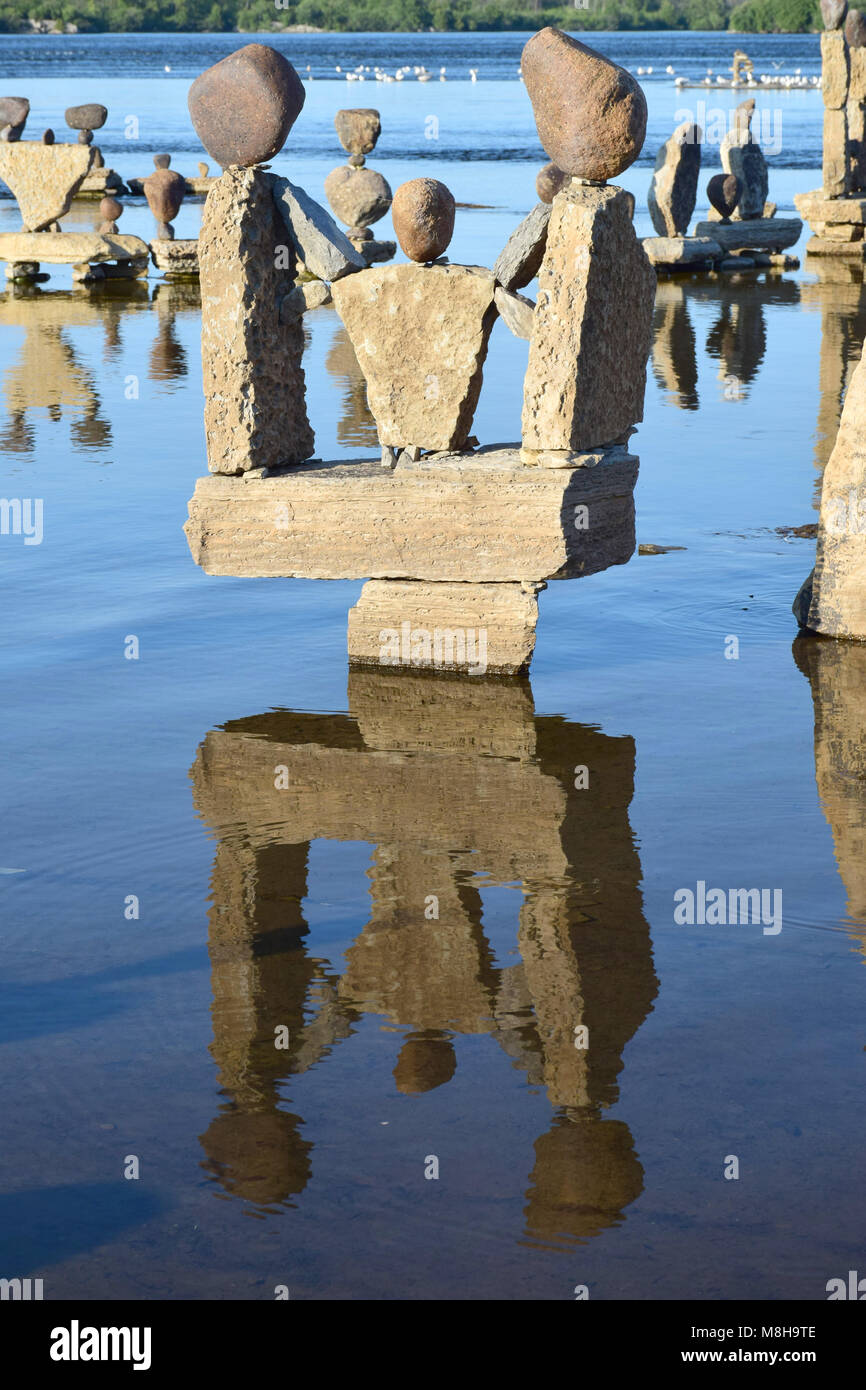 Balanced rock sculptures in the water Stock Photo - Alamy