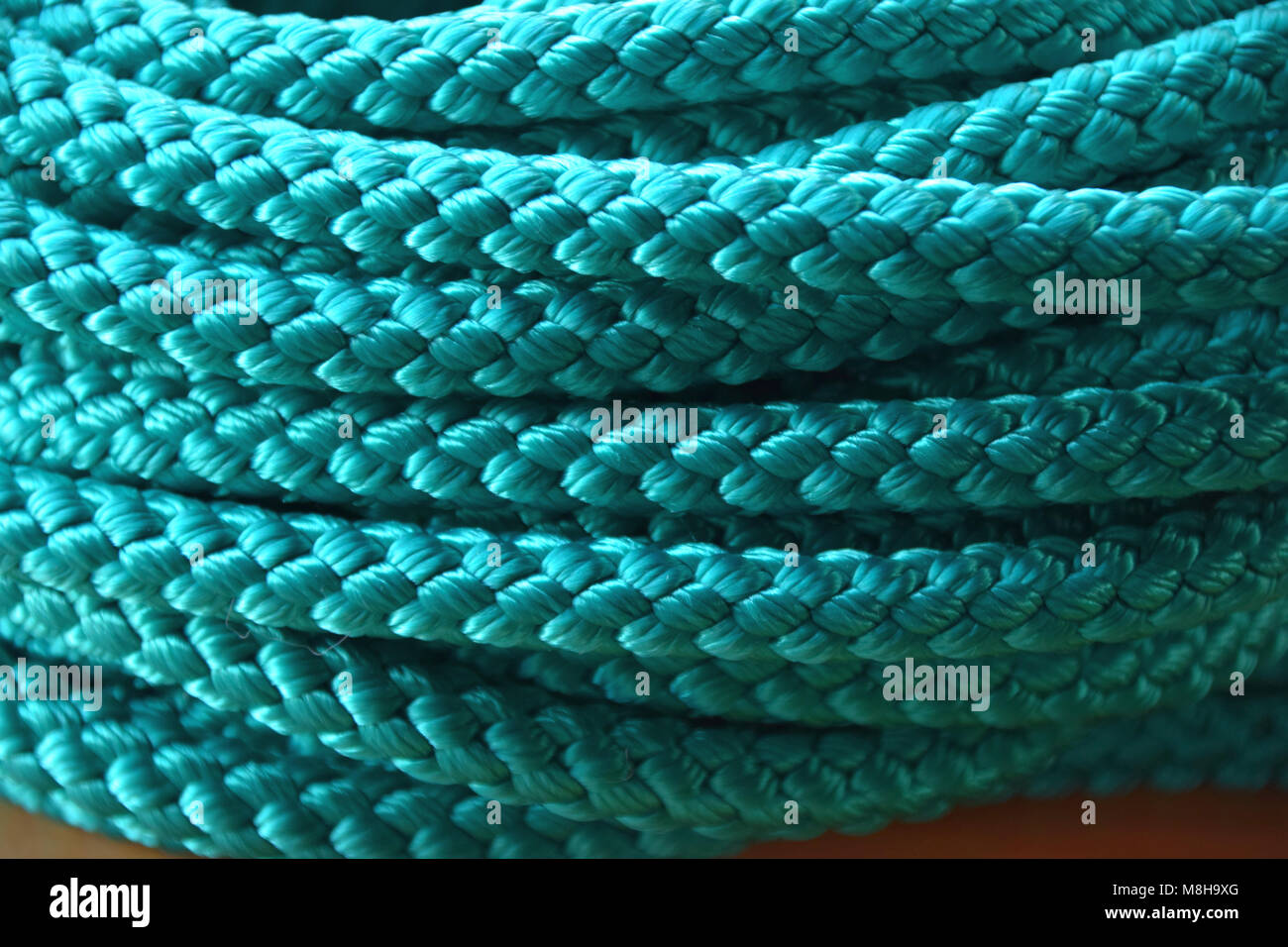 roll of synthetic rope in turquoise color Stock Photo - Alamy