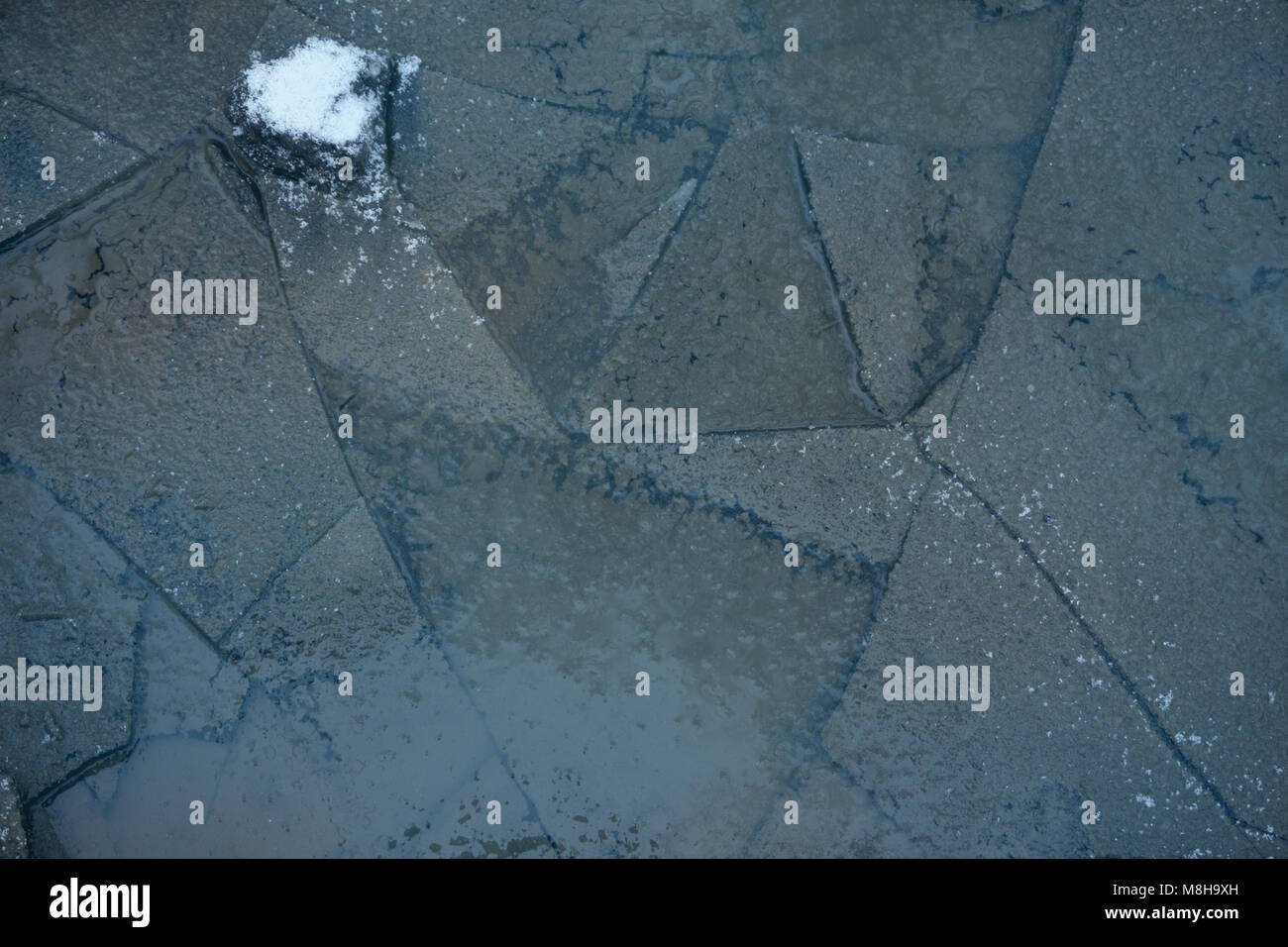 ice background texture. Melting ice with different shapes and cracks ...