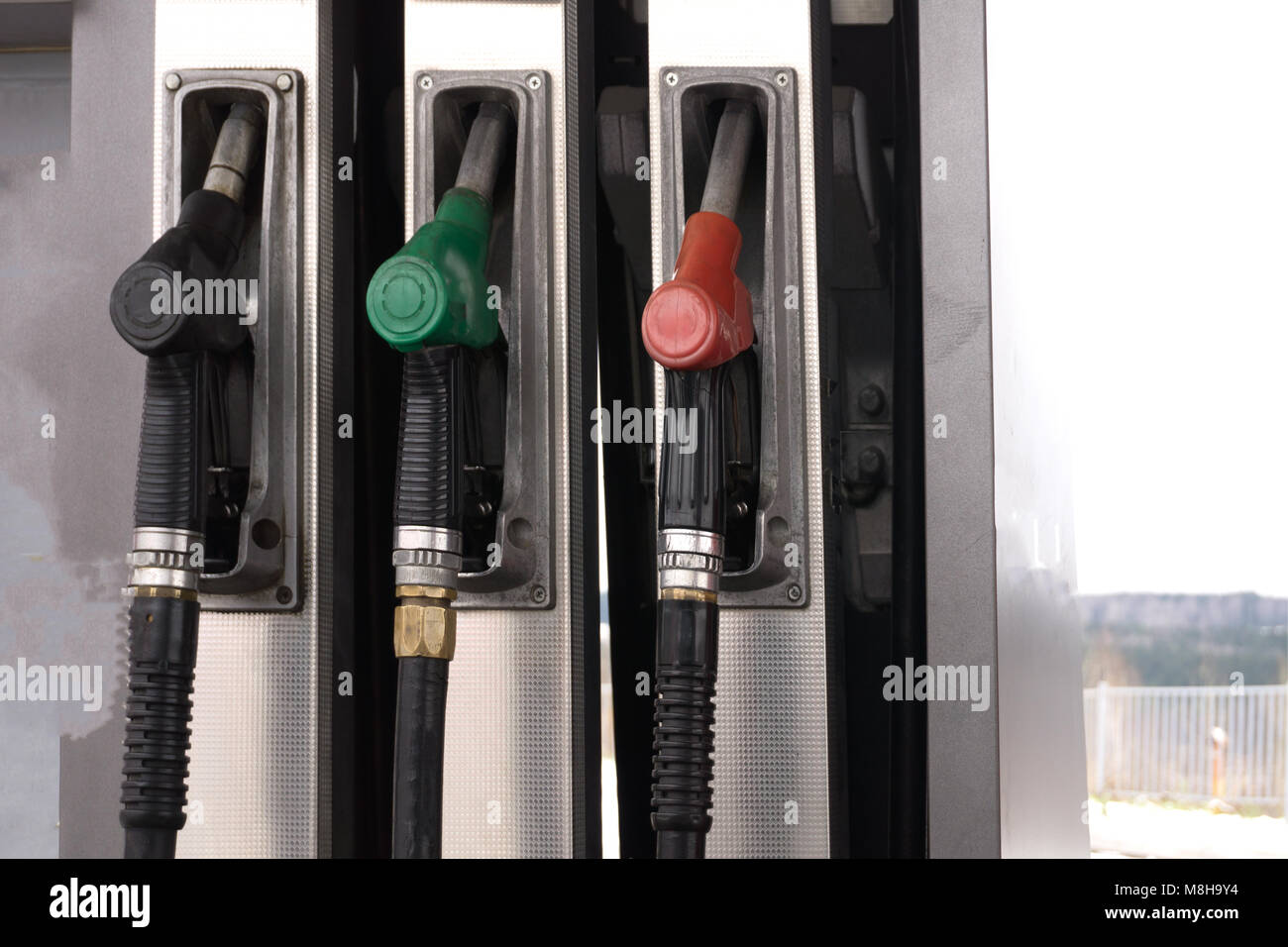 Fuel Pistols front view pollution pomp power Stock Photo - Alamy
