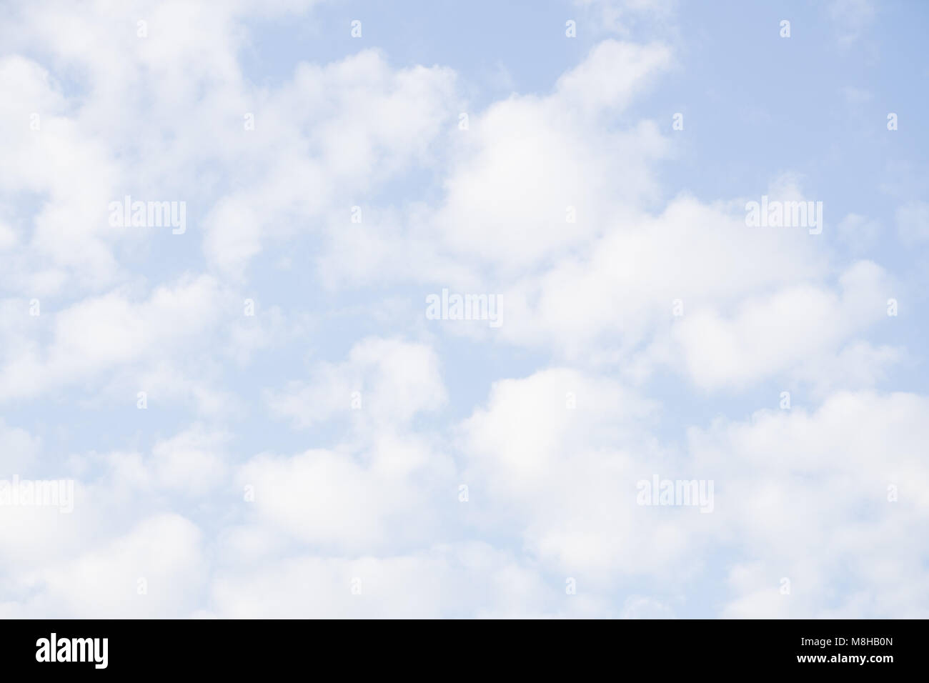 Light blue sky with clouds - abstract background Stock Photo - Alamy