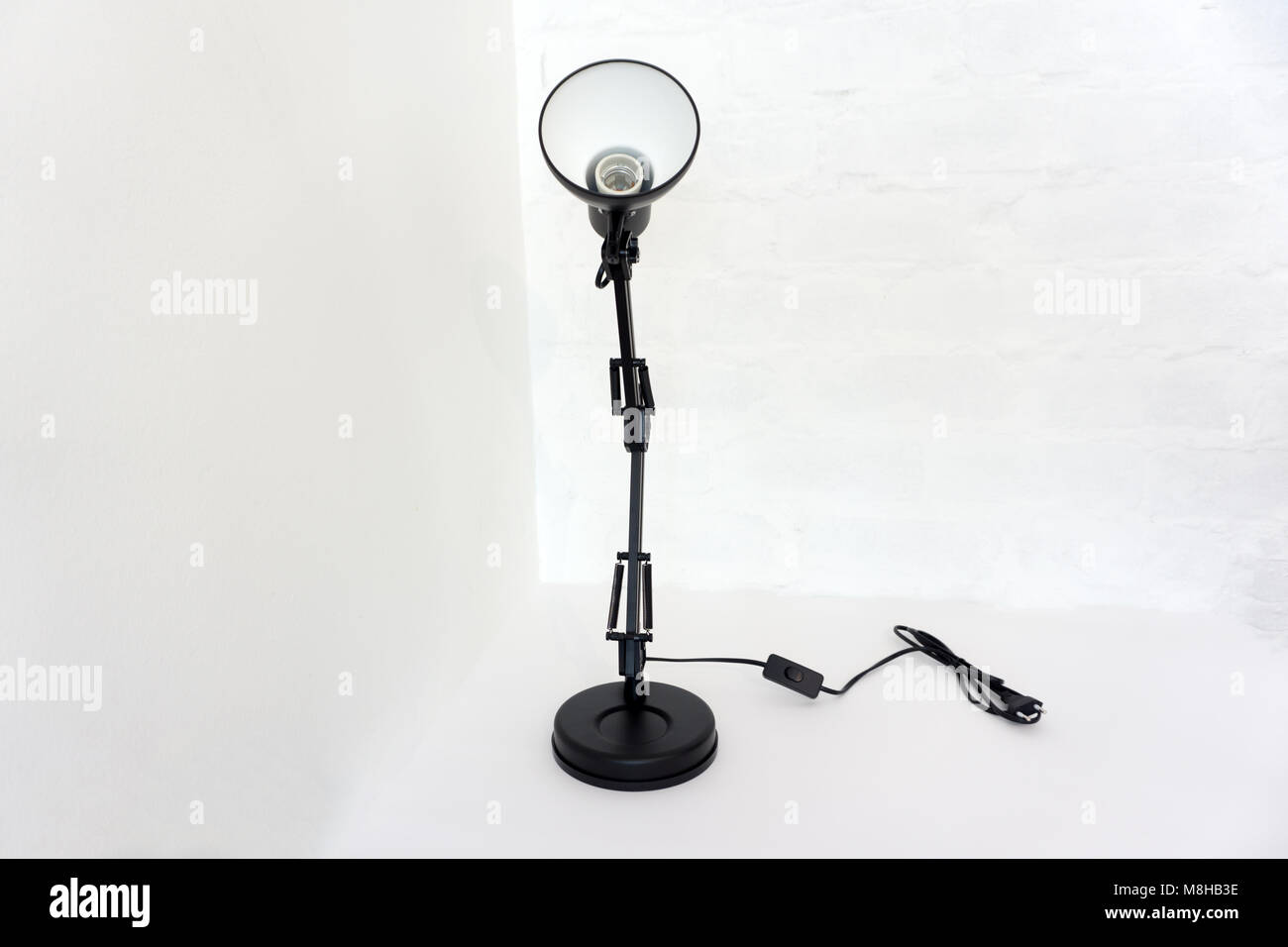 Vintage black desk lamp isolated on white Stock Photo - Alamy