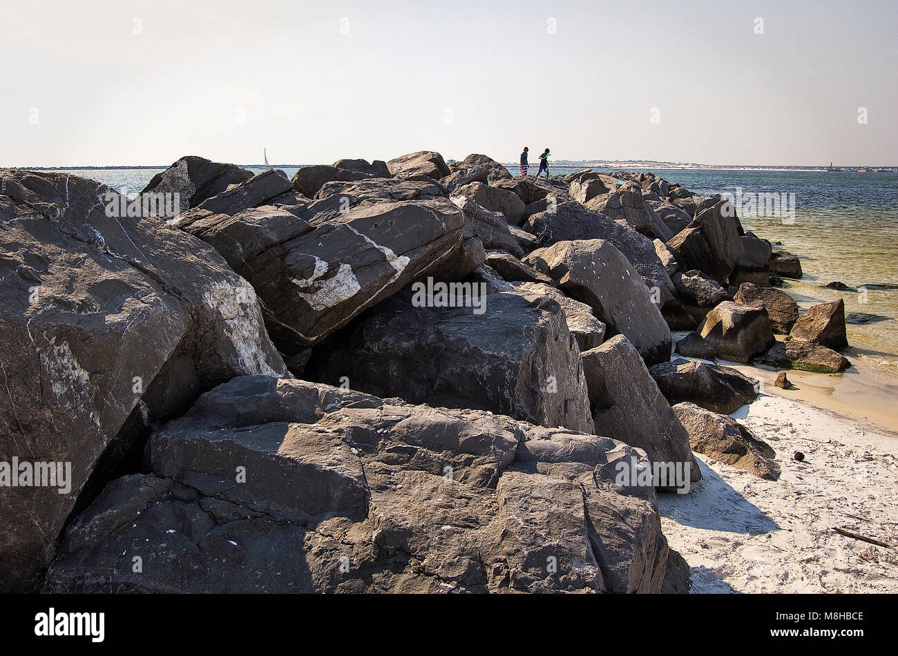 A tide breaker wall on the white sand beach shore of Florida Stock ...