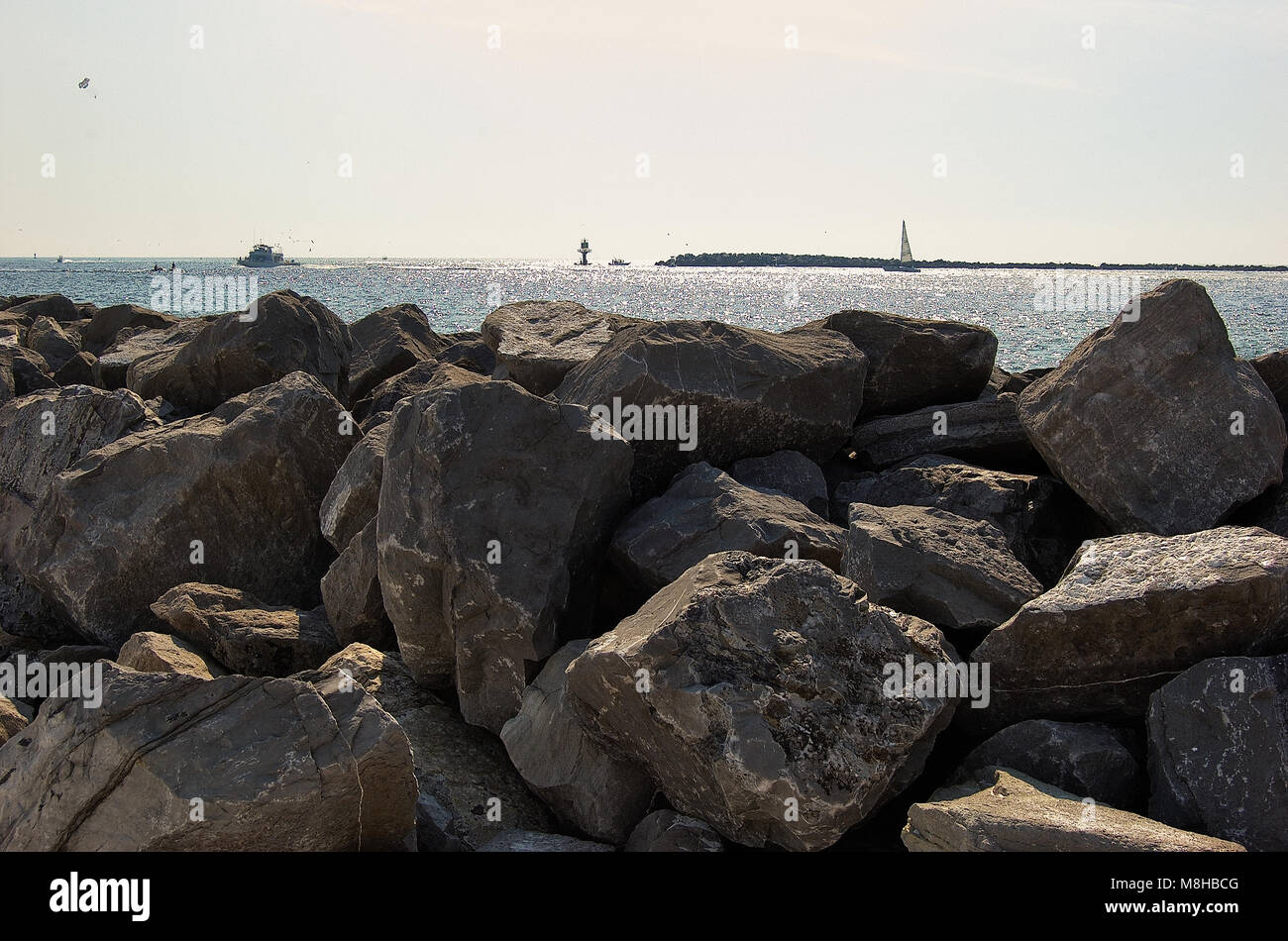 A tide breaker wall on the white sand beach shore of Florida Stock ...