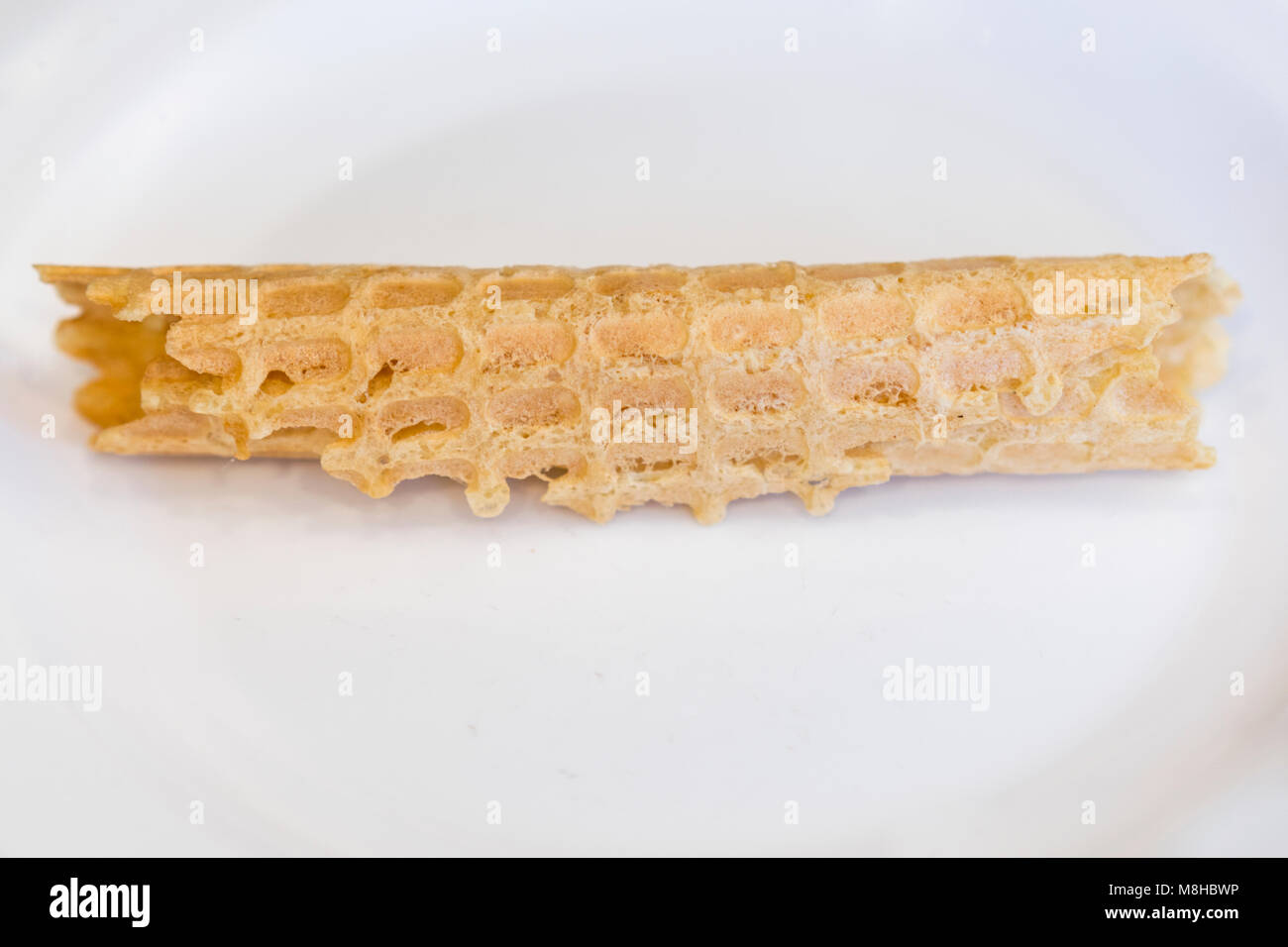 Waffle straw on white background Stock Photo - Alamy