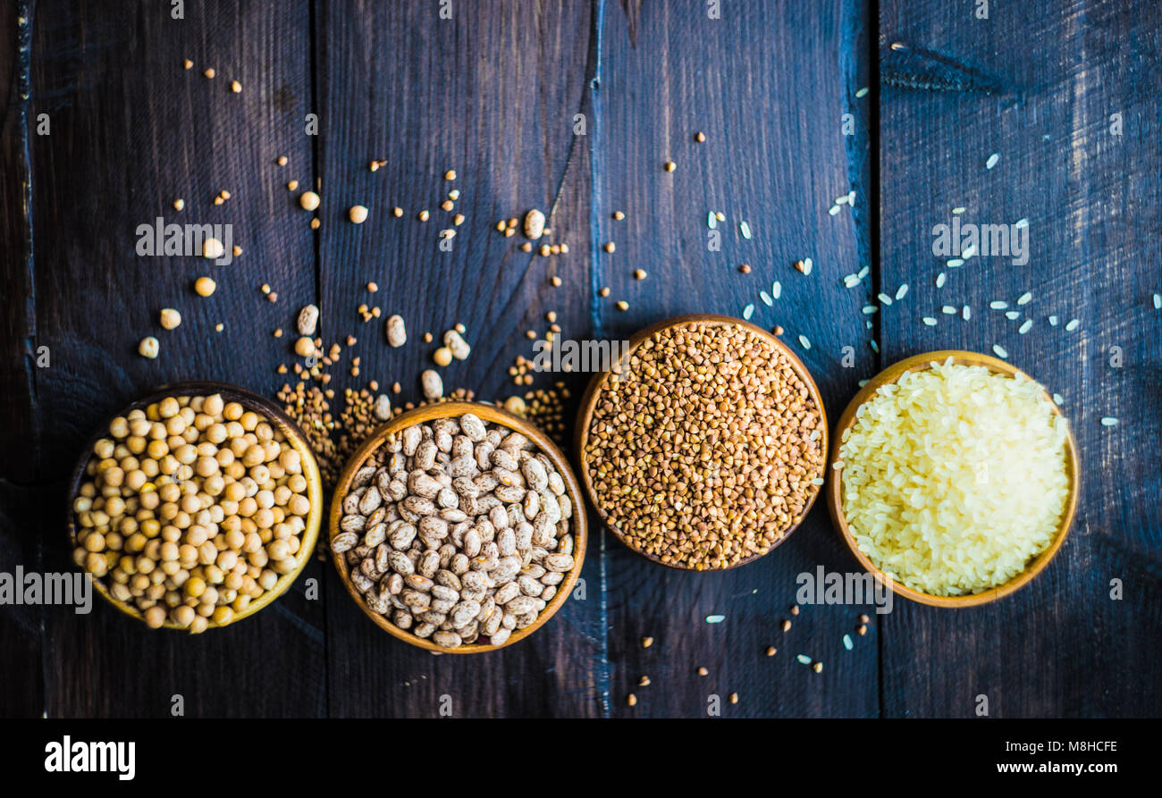 Organic superfood concept with raw chick peas, buckwheat, beans, rice ...