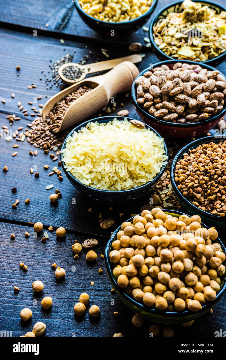 Organic superfood concept with raw chick peas, buckwheat, beans, rice ...