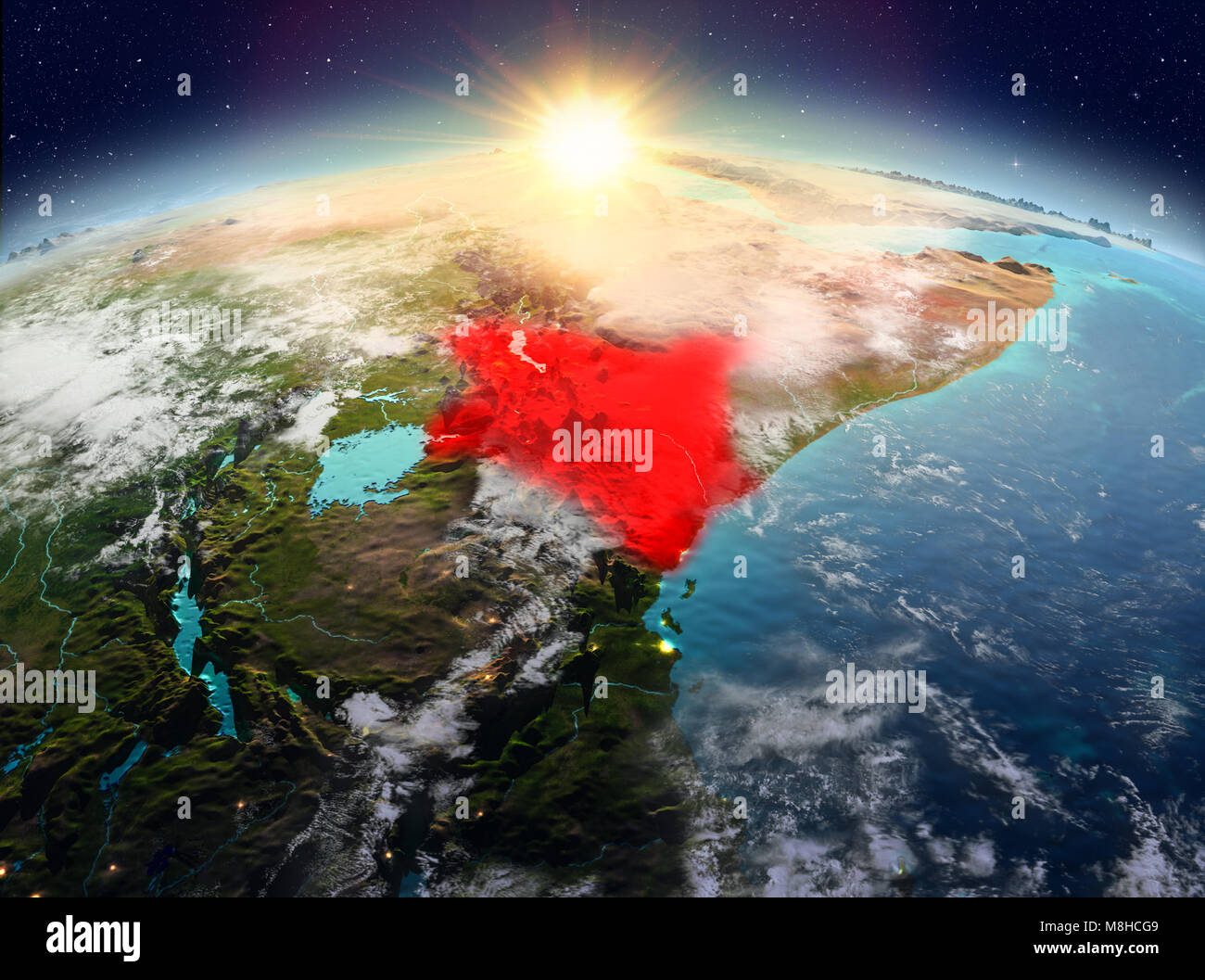 Satellite view of Kenya highlighted in red on planet Earth with clouds during sunrise. 3D ...