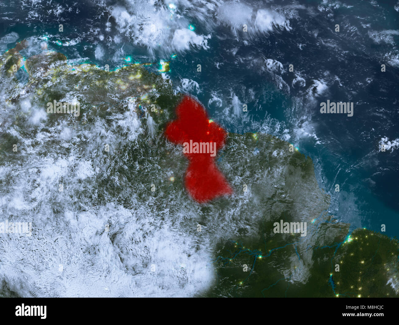 Country of Guyana in red on planet Earth with clouds at night. 3D ...
