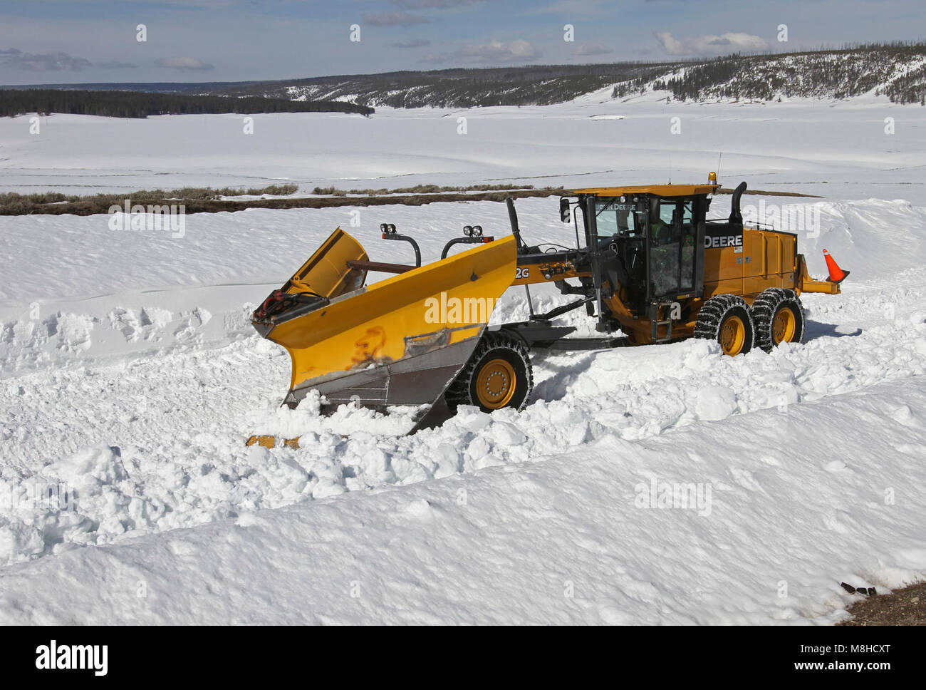 Grader clearing snow in Hayden Valley Stock Photo - Alamy