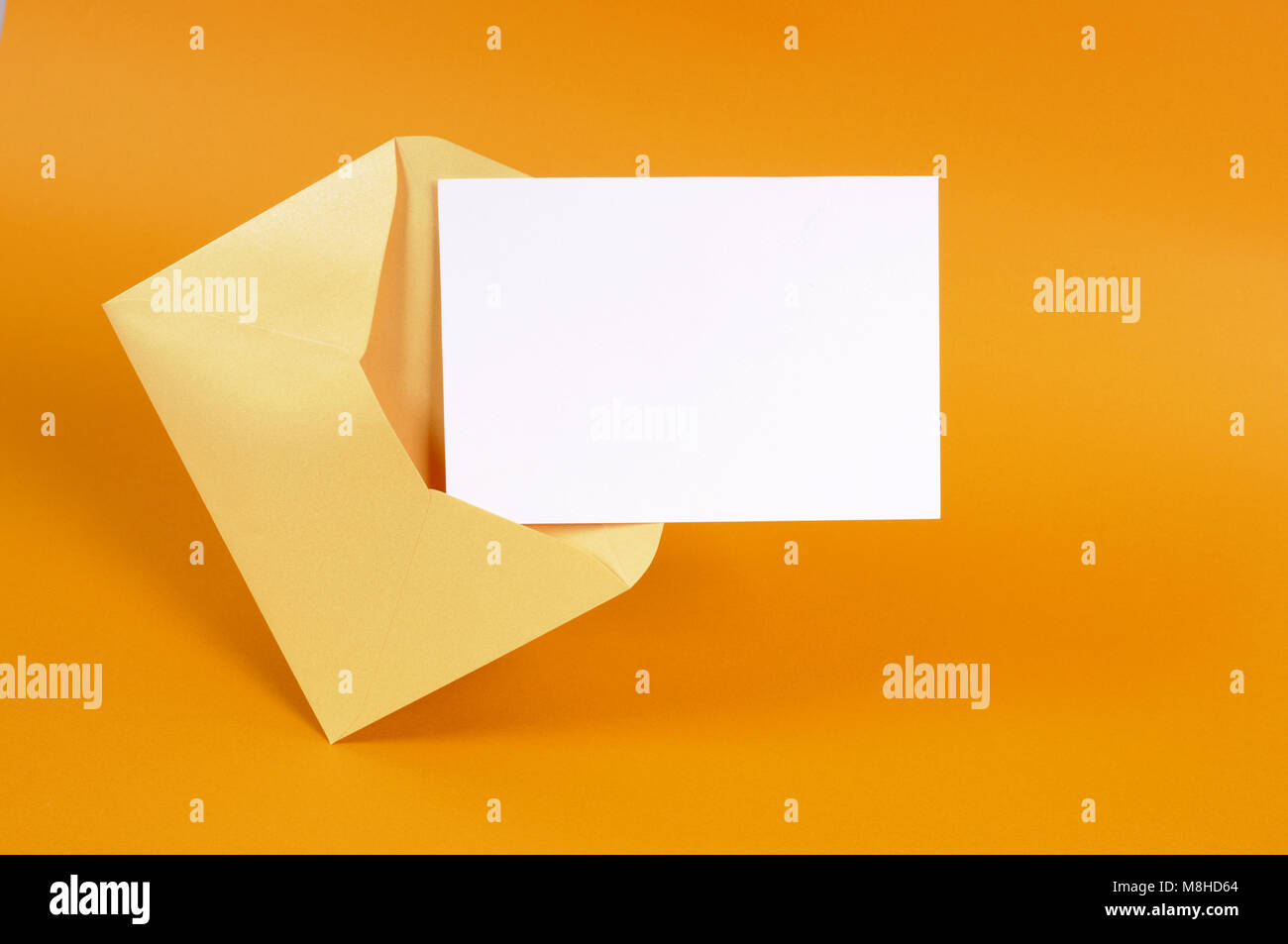 Metallic gold envelope with blank message card letter or invitation ...