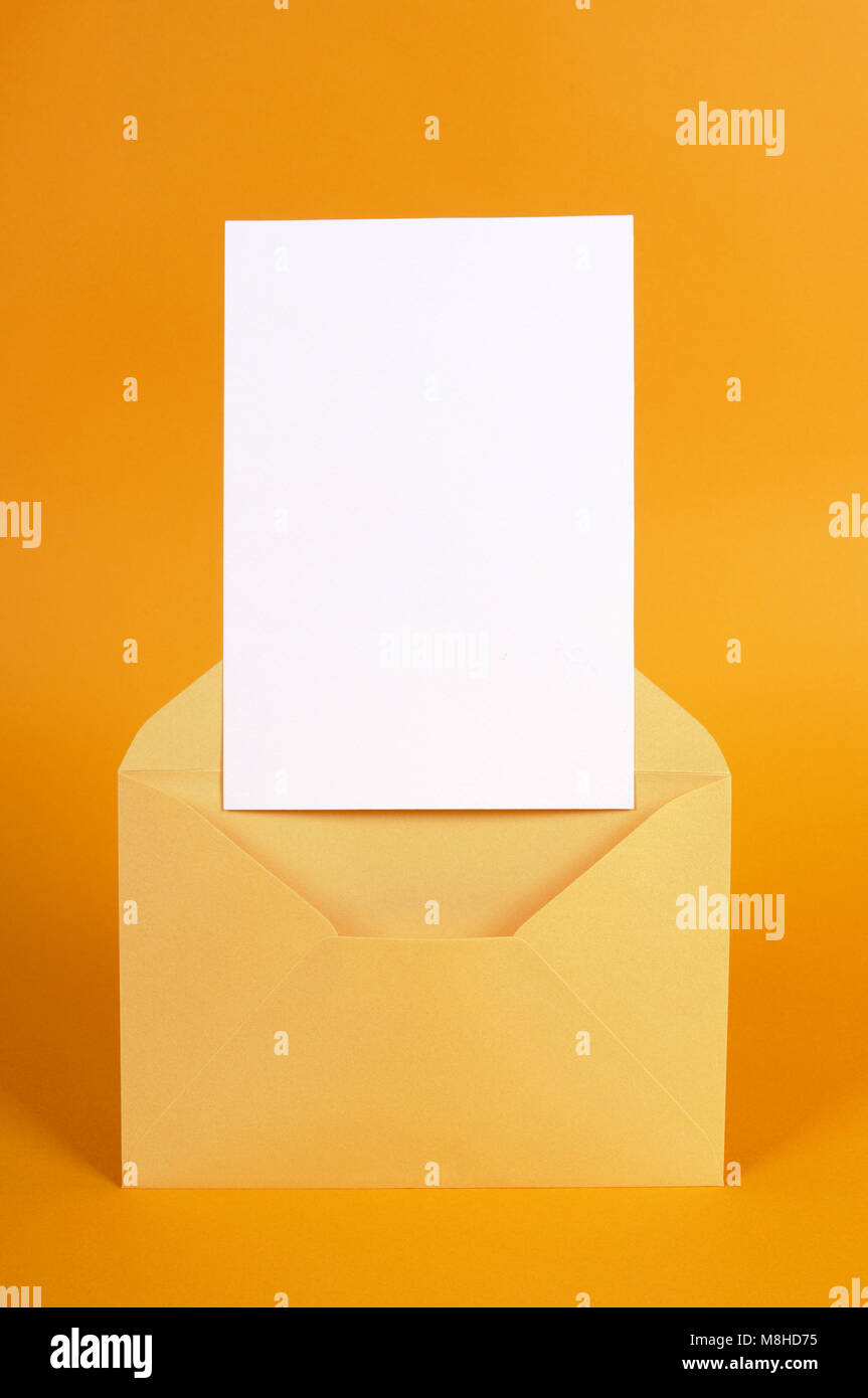 Metallic gold envelope with blank message card letter or invitation ...