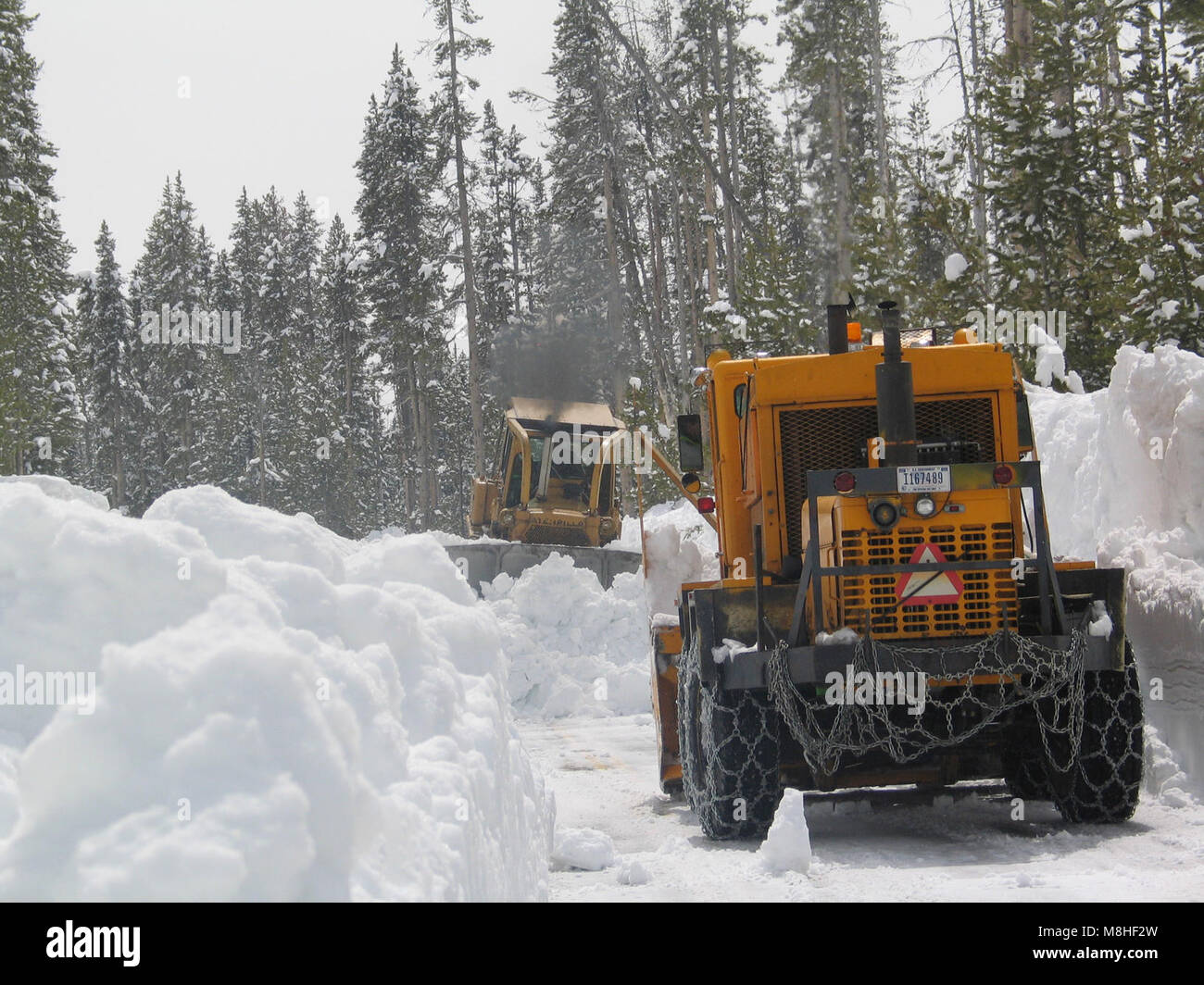 Pushing snow to the blower at Lewis River. Spring plowing Stock Photo ...