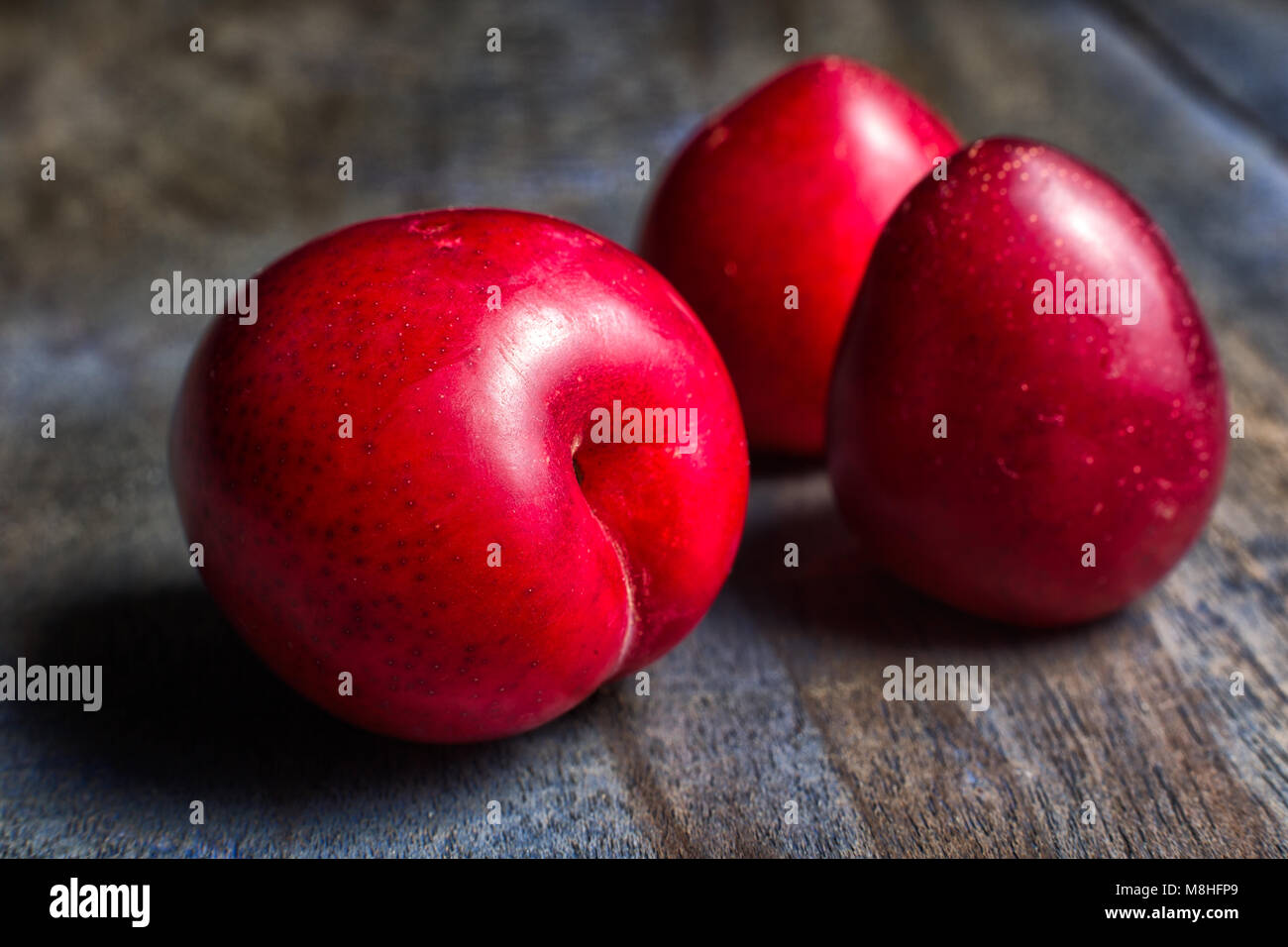 small red plums called claudia in Ecuador Stock Photo - Alamy
