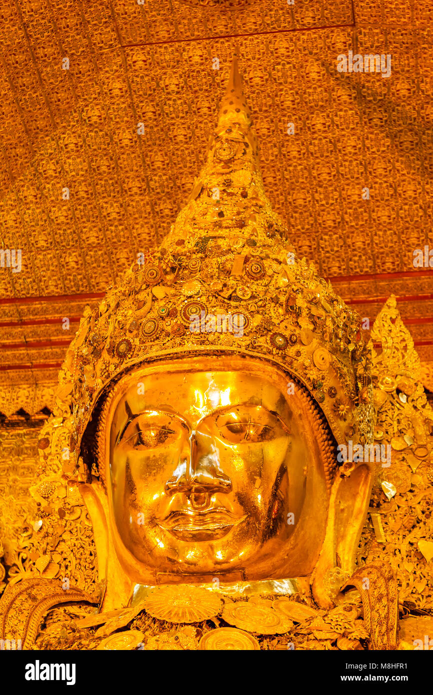 Big golden holy Mahamuni Buddha Image in Buddhist Temple at Mandalay ...